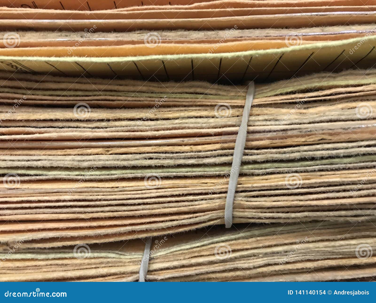 Many Stacked Yellow Envelopes Separated into Packages with Rubber Bands ...