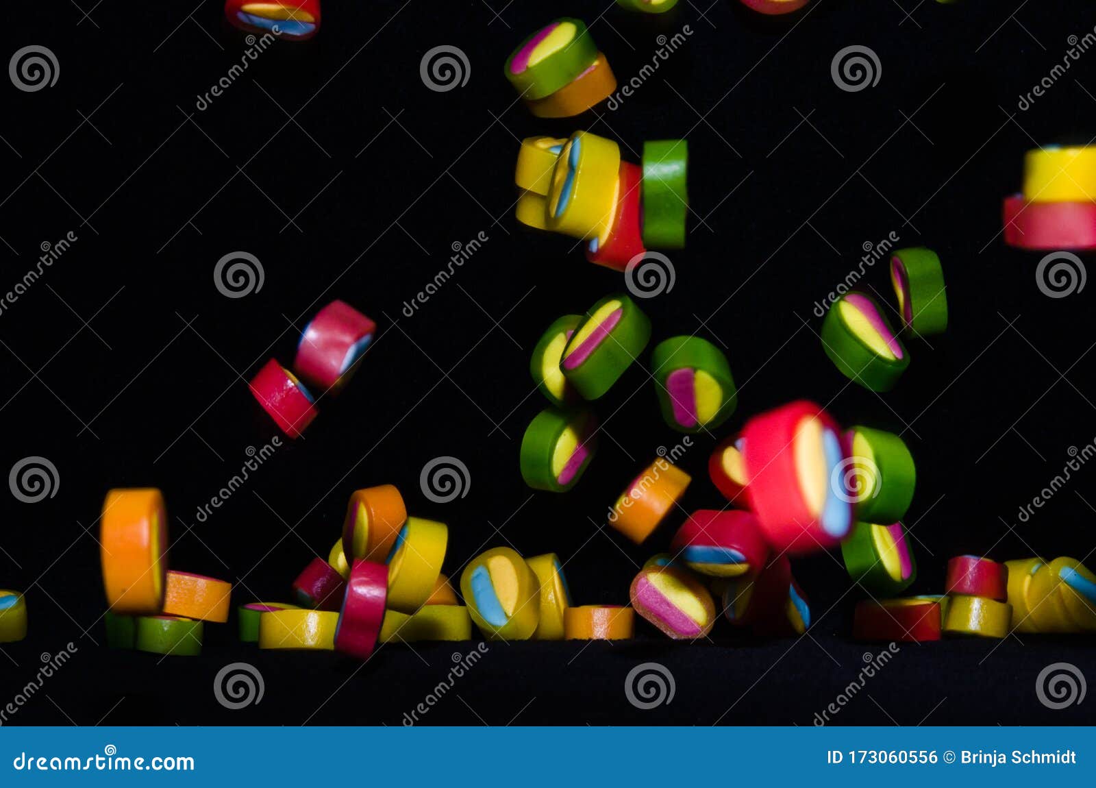 Many Sweet and Colourful Candies are Falling Down To the Table Stock ...