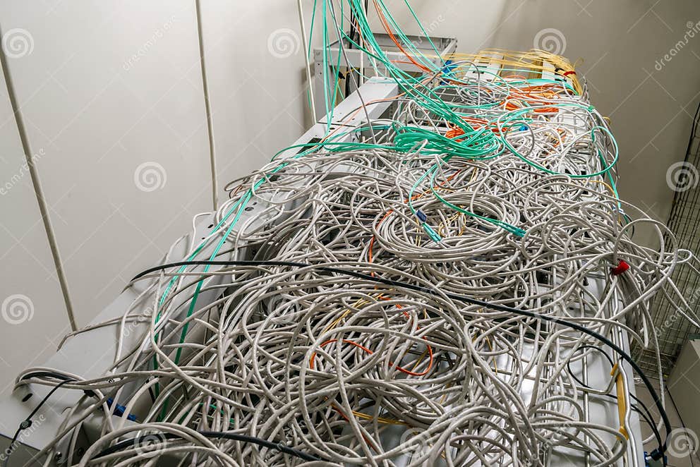 Many Tangled Wires are on Top of the Server Racks of the Data Center ...