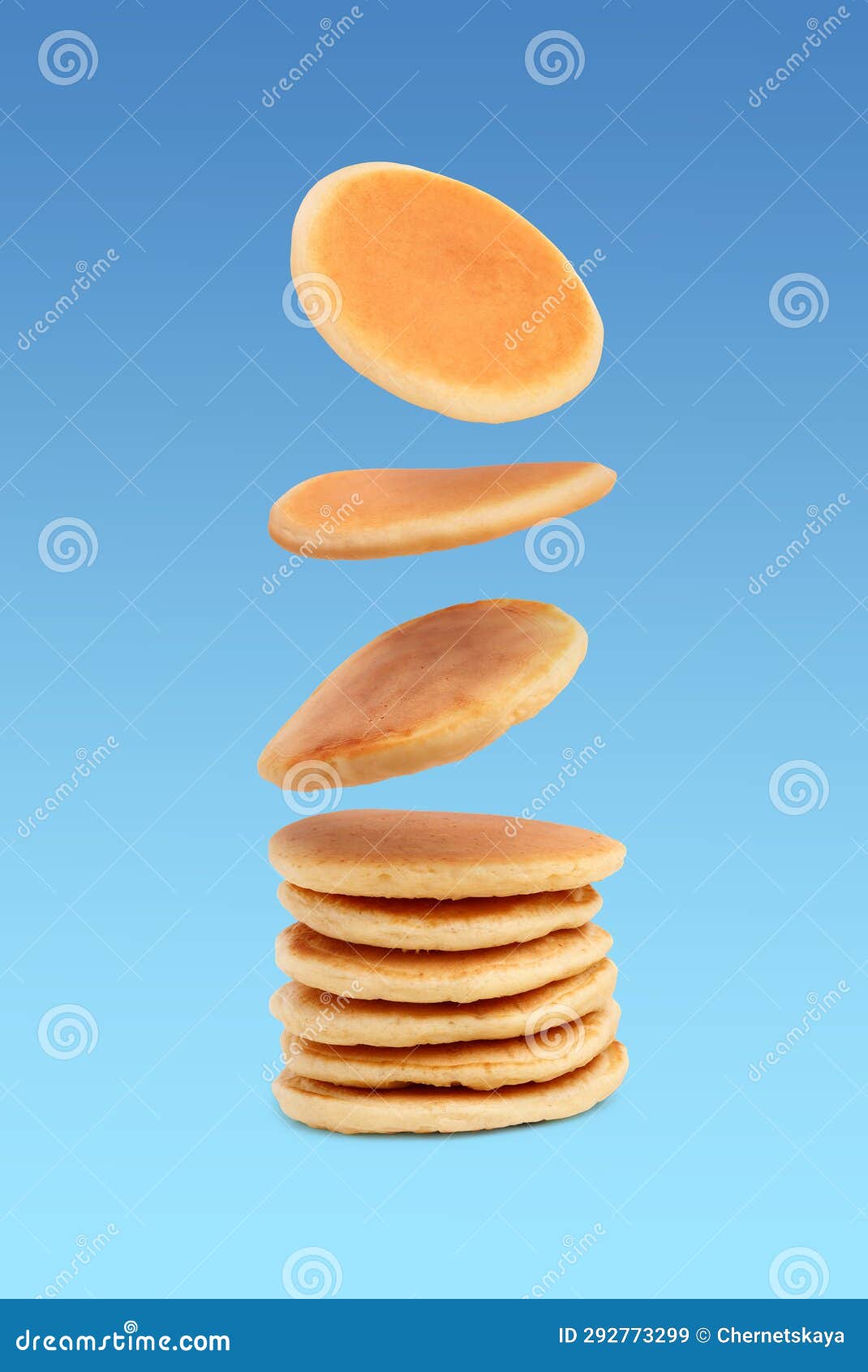 Many Tasty Fresh Pancakes Falling on Light Blue Background Stock Image ...