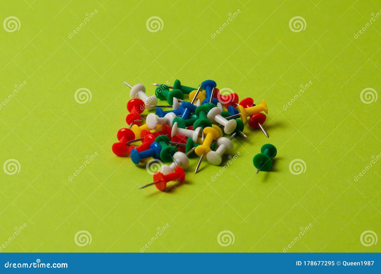 Many Thumbtacks of Different Colors on Green Designer Paper Stock Image ...