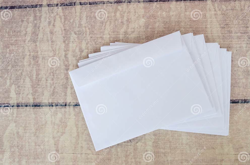Many White Blank Envelopes on a Wooden Table. Stock Image - Image of ...