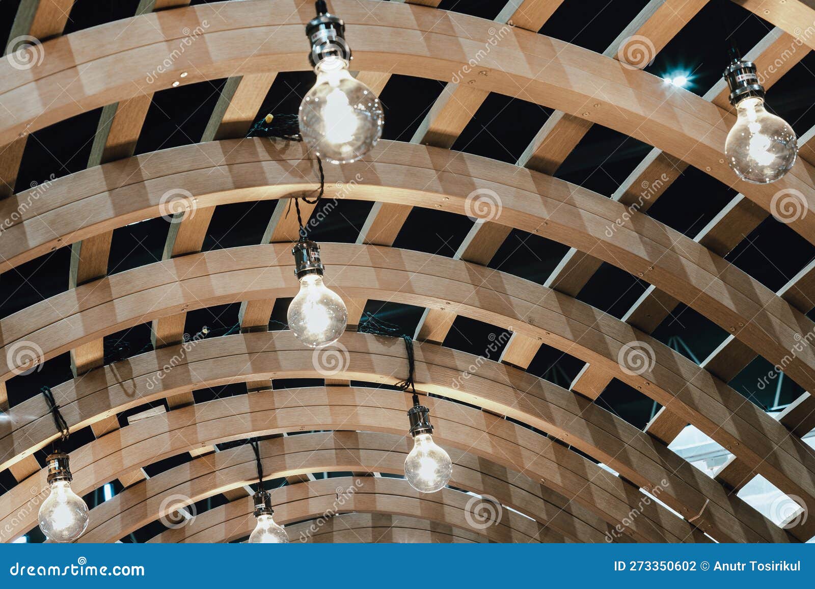 Many White Light Bulbs are Hung on the Ceiling of the Wooden Curved ...
