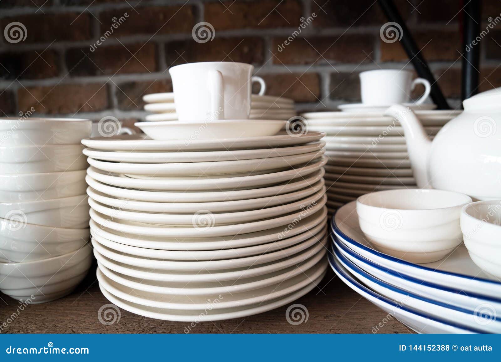 Many White Plates are Stacked Together.a Stack of White Dish Stock ...