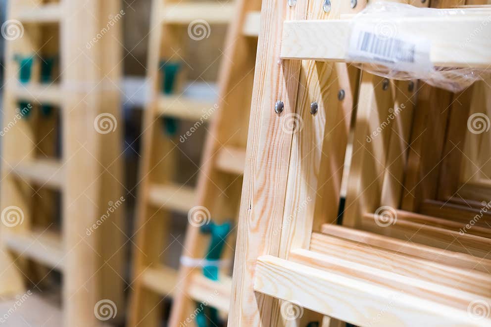 Many Wooden Ladders. Stack of Wooden Stairs in a Store. Stock Image ...