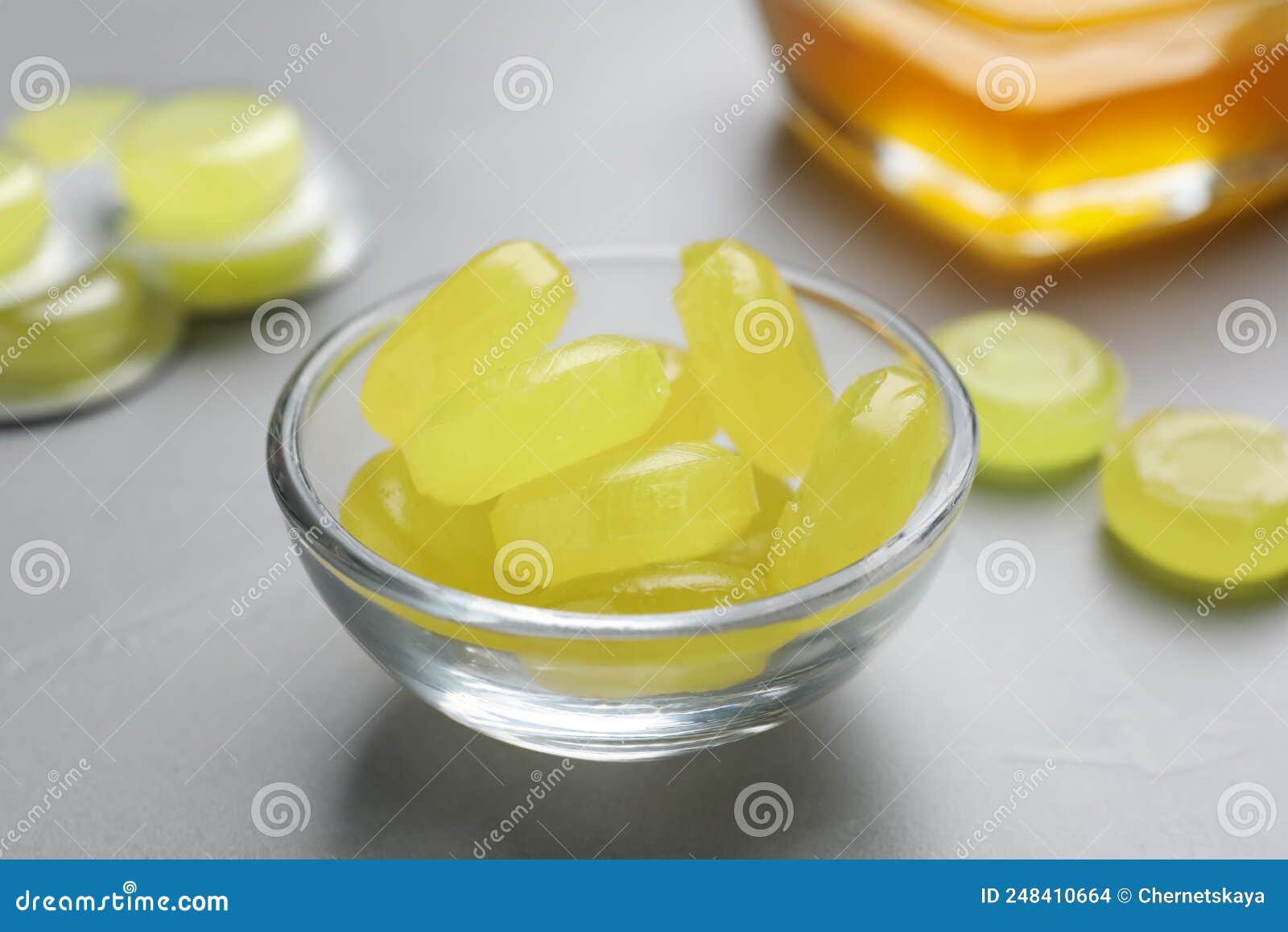 Many Yellow Cough Drops on Light Grey Table Stock Photo - Image of ...