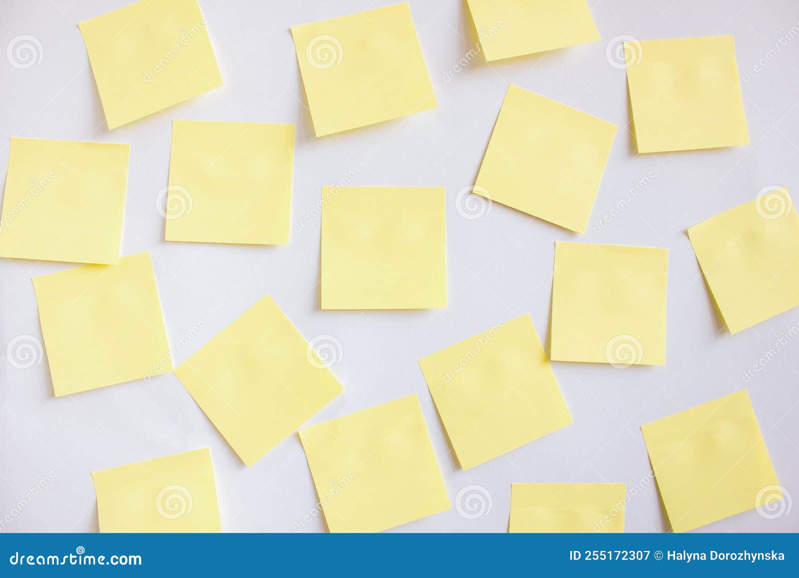 Many Yellow Papers for Notes on a White Wall Stock Image - Image of ...