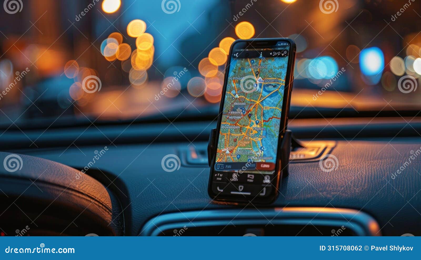 The Map on the Phone in the Background of the Dashboard and Street ...