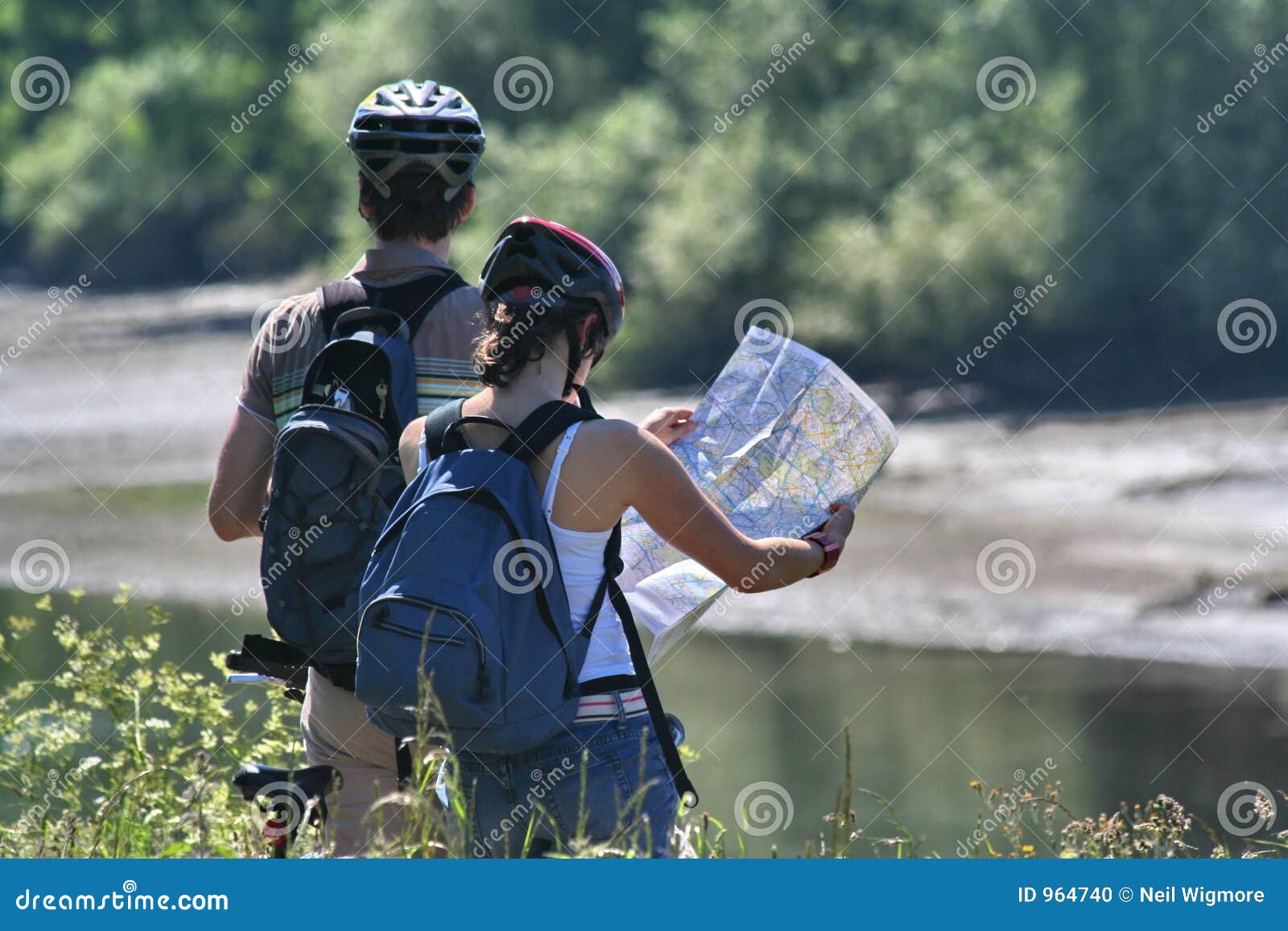 Map reading couple stock photo. Image of bike, riverbank - 964740