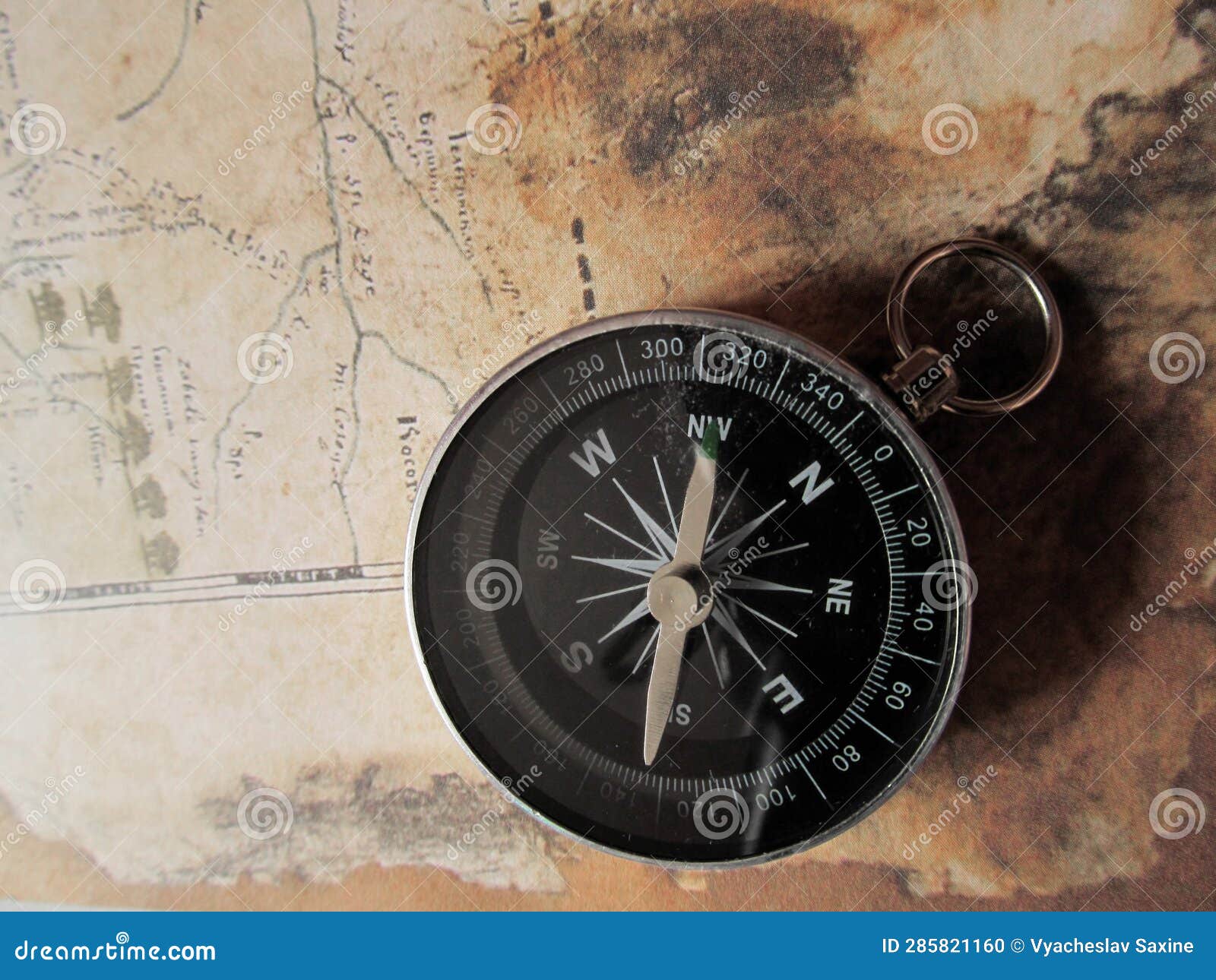 Map search using a compass stock photo. Image of retro - 285821160