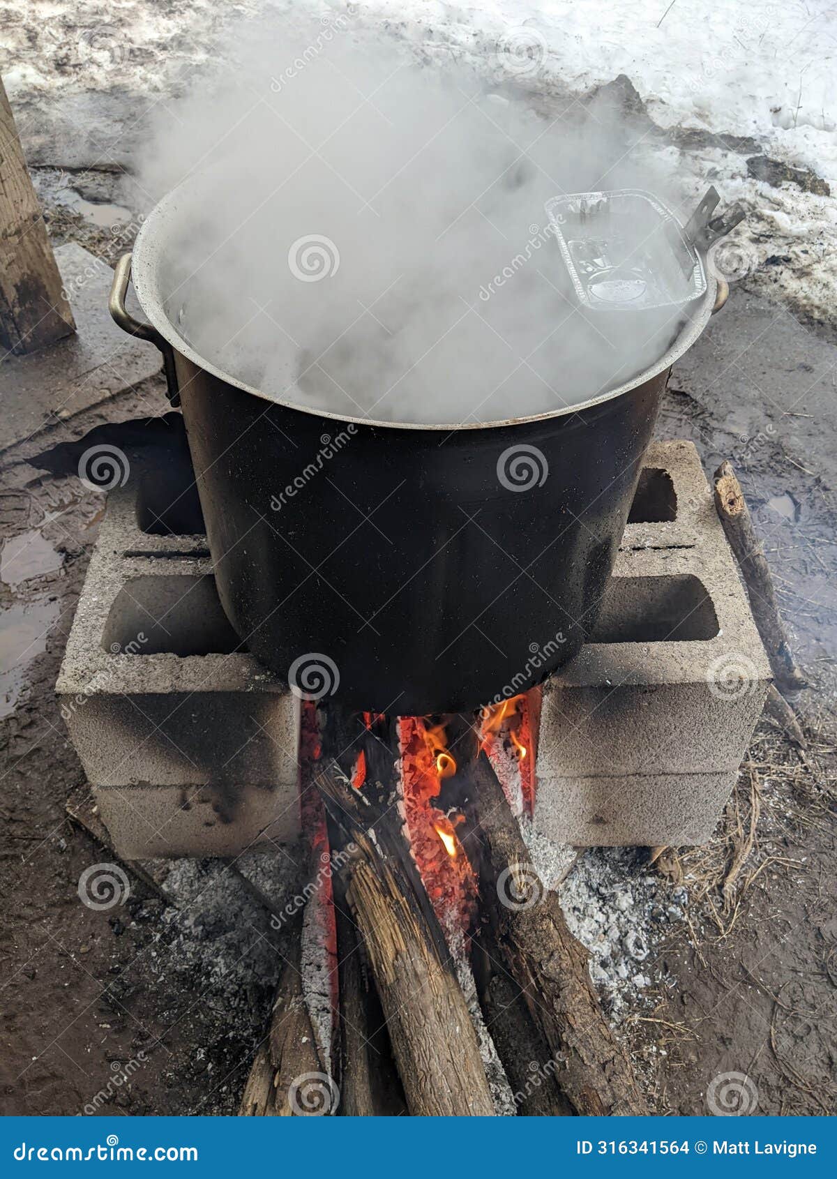 Maple Sap Boiling in a Pot Over a Fire Stock Photo - Image of snow ...