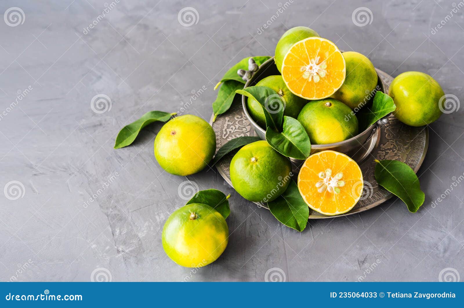 Mapo Fruits on the Plate and Grey Background with Copy Space Stock ...