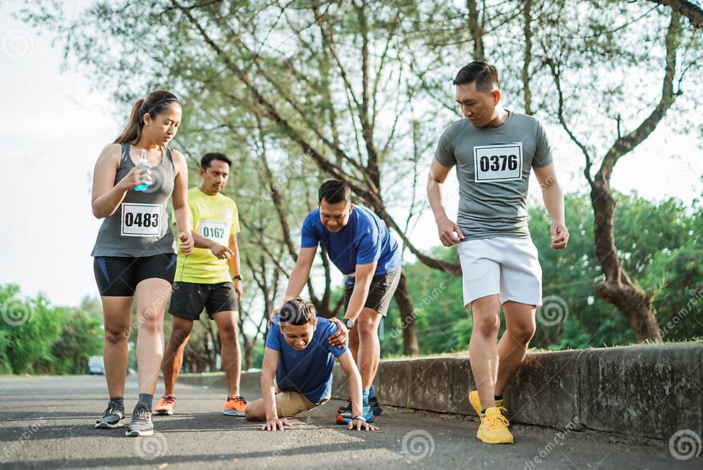 Marathon Participant Falling with Sprained Ankle Stock Photo - Image of ...