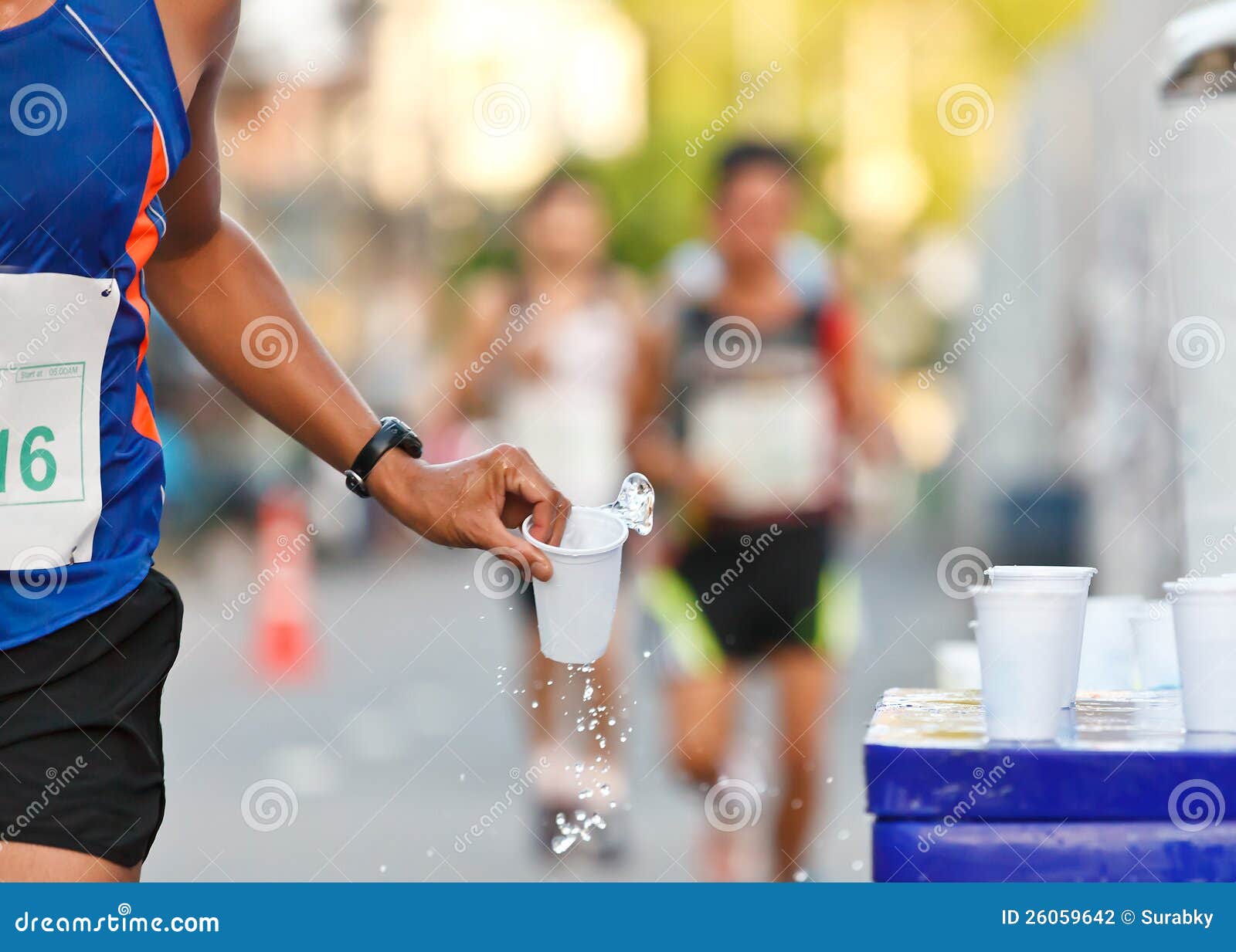 Marathon Racer Catching Cup of Water Stock Photo - Image of outdoor ...