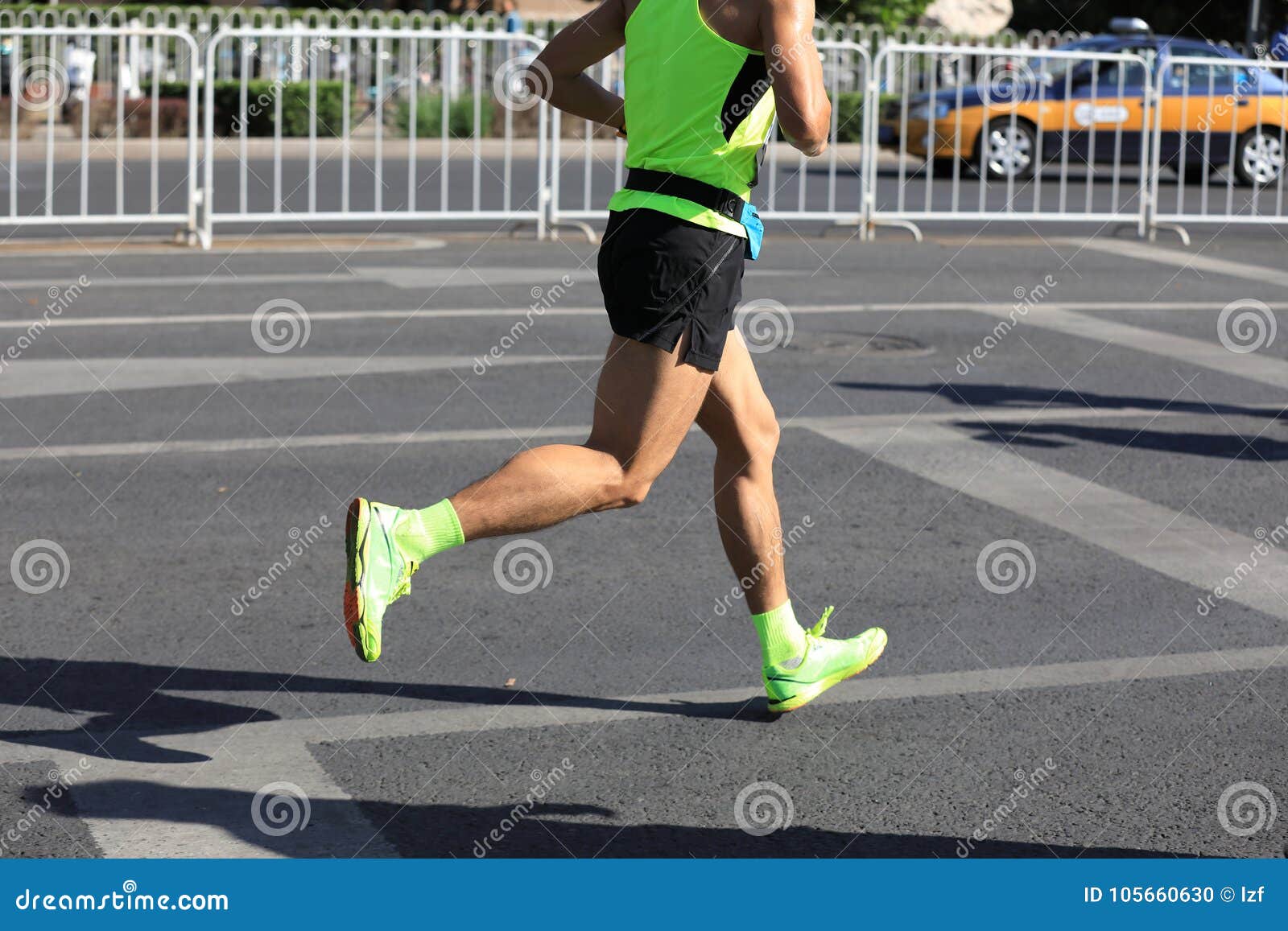 Marathon Runner Running on the Road Stock Photo - Image of legs ...