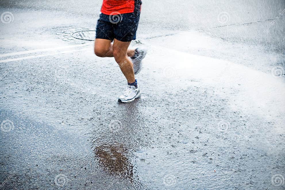 Marathon Runner in Rain on City Streets Stock Photo - Image of leisure ...