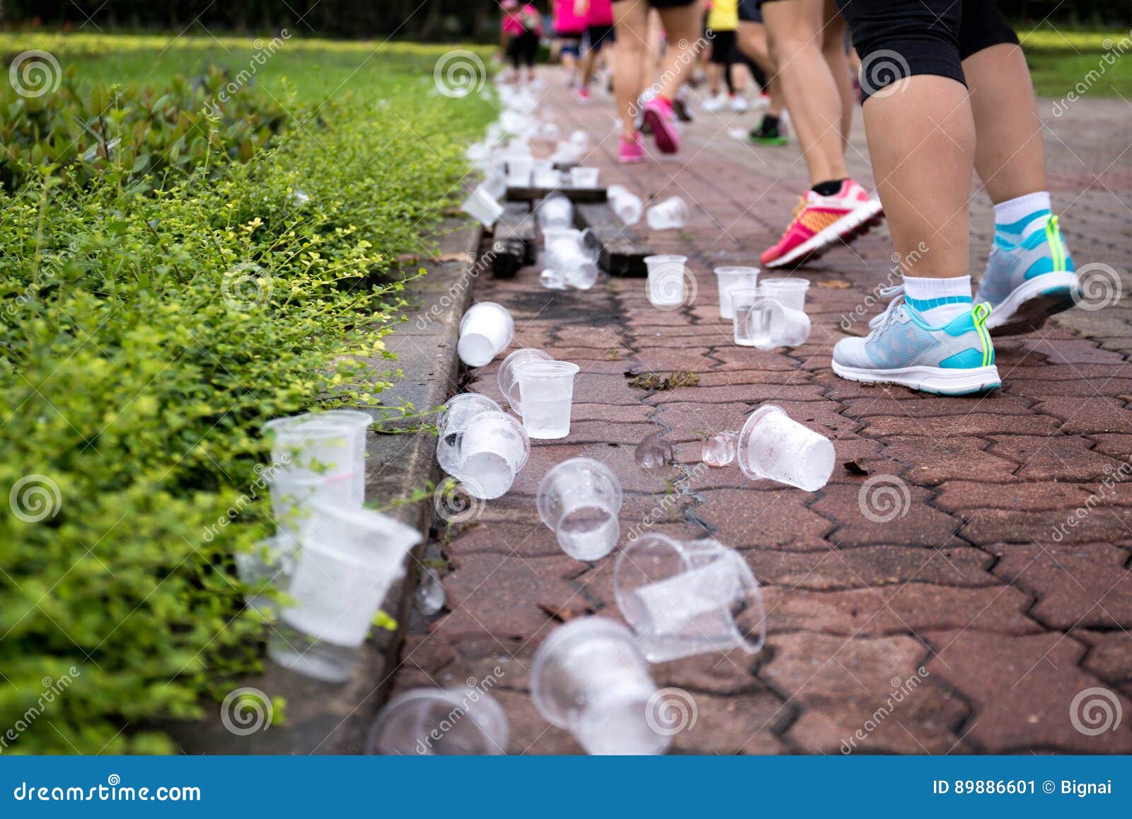Marathon Runners Feet and Emptry Water Cups on Refreshment Point Stock ...