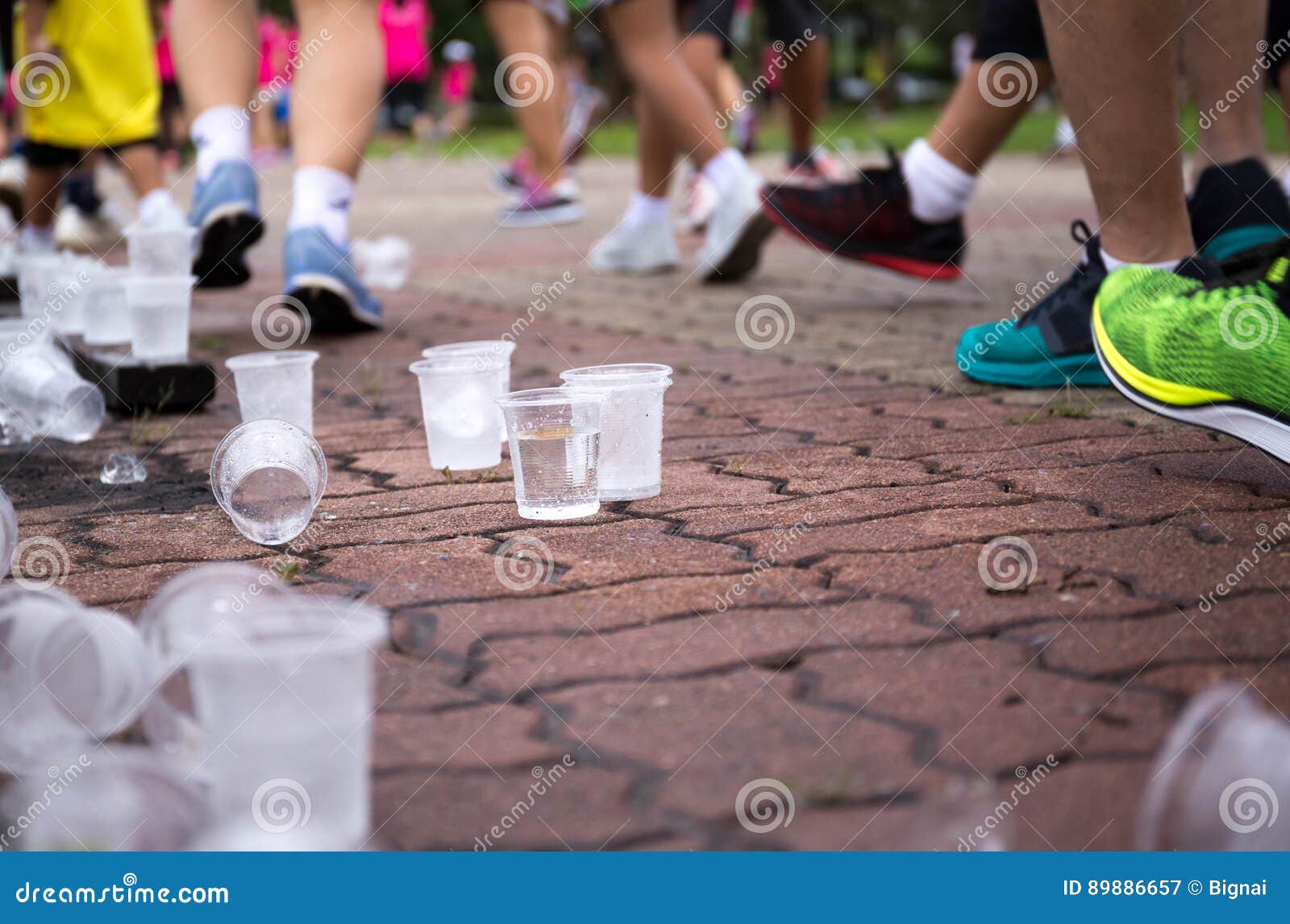 Marathon Runners Feet and Emptry Water Cups on Refreshment Point Stock ...
