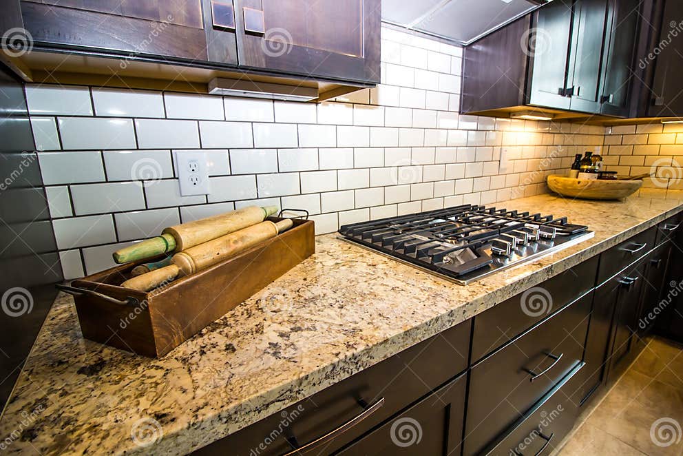 Granite Counter Top with Large Rolling Pins in Modern Kitchen Stock ...