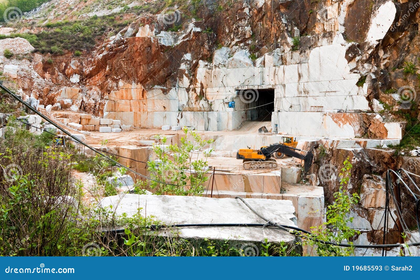 Marble quarry with digger stock image. Image of mineral - 19685593
