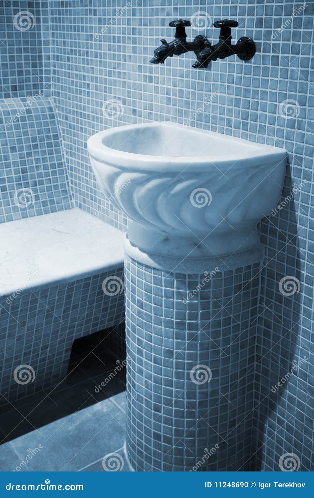 Marble Sink In A Public Restroom With Retro Golden Water Tap With ...