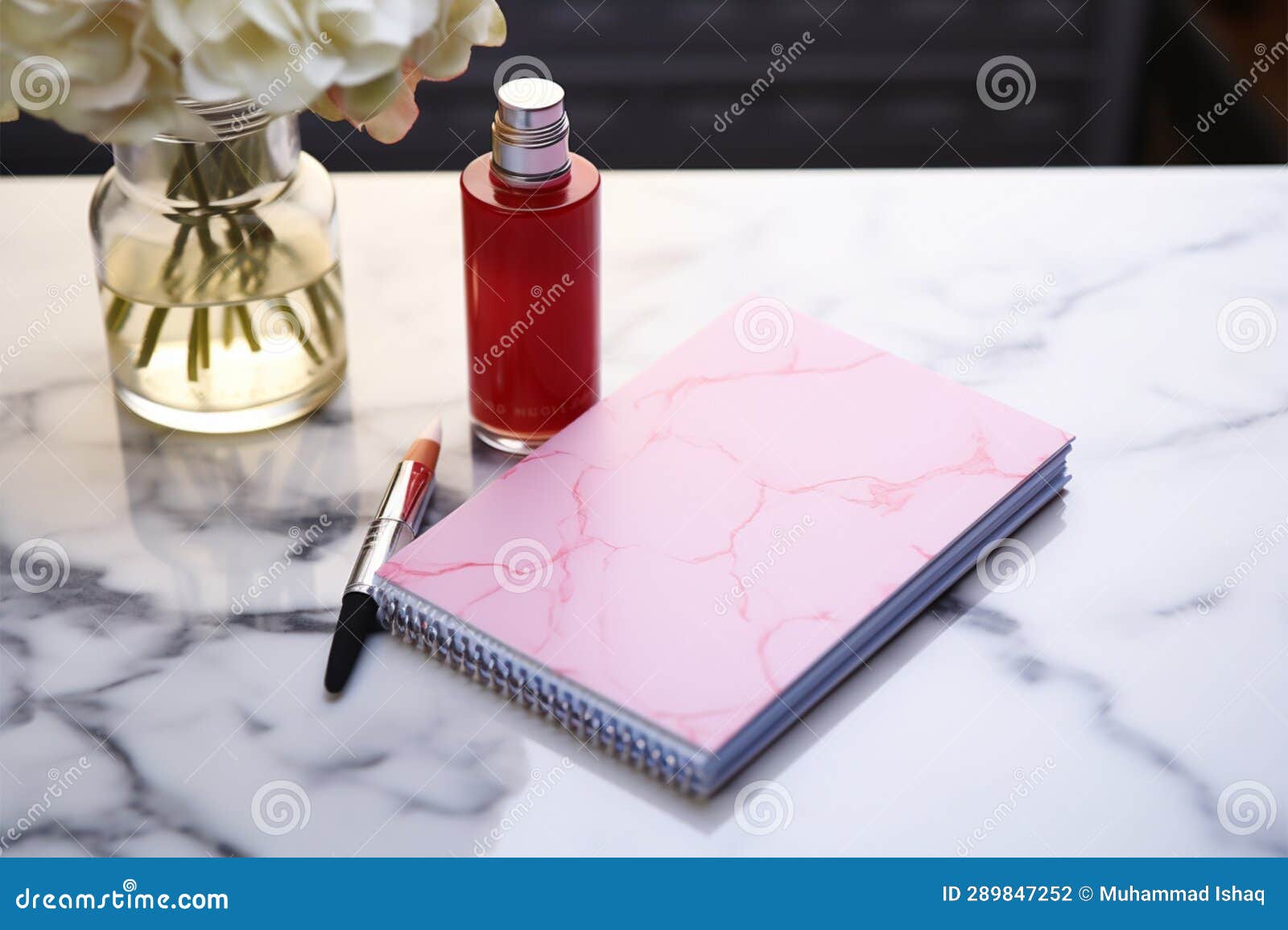Marble Surface Adorned with Notepad, Pen, and Vibrant Nail Polish Stock ...