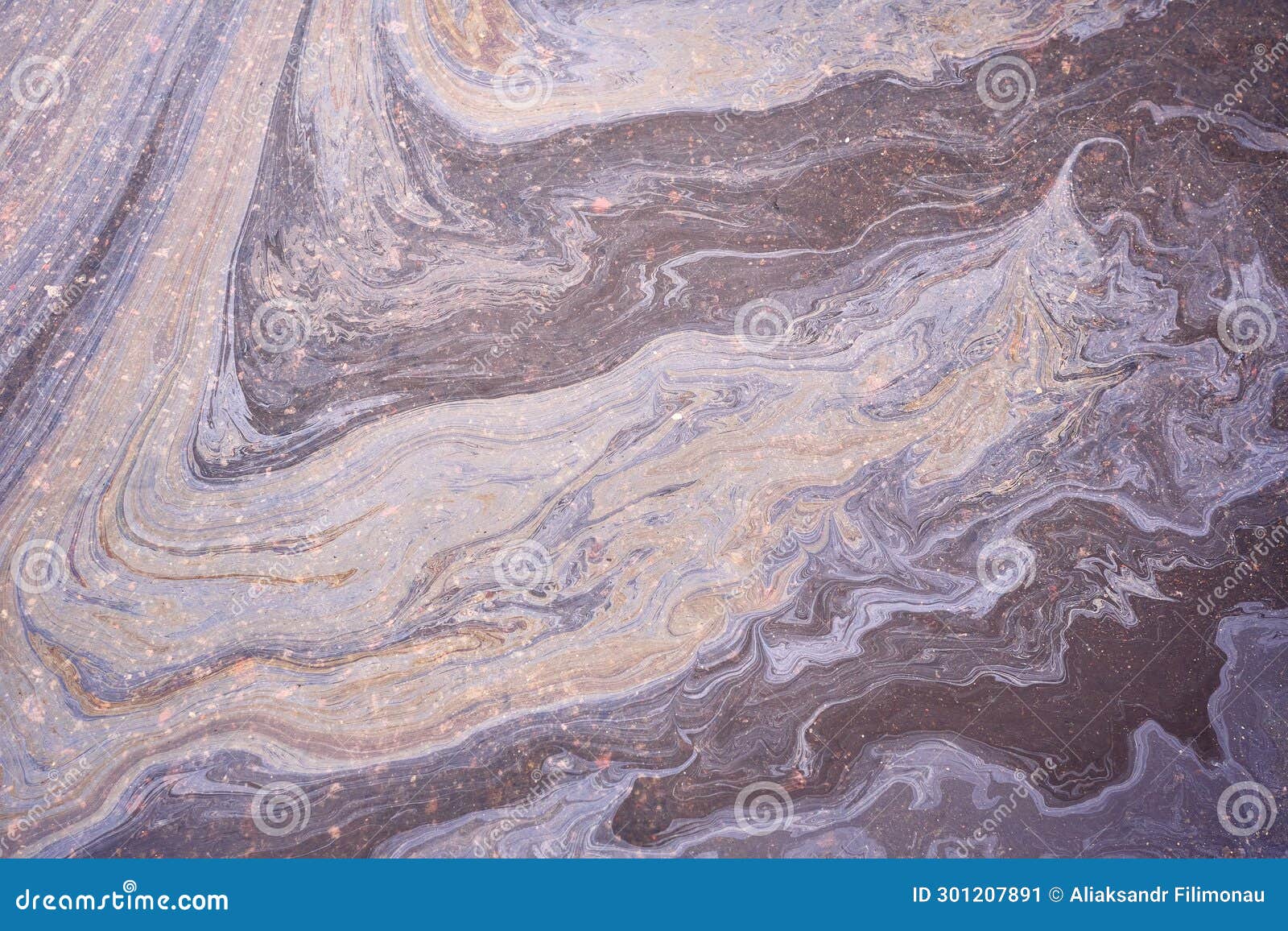 A Marble Texture of a Rainbow Spill of Gasoline on a Sidewalk in a ...
