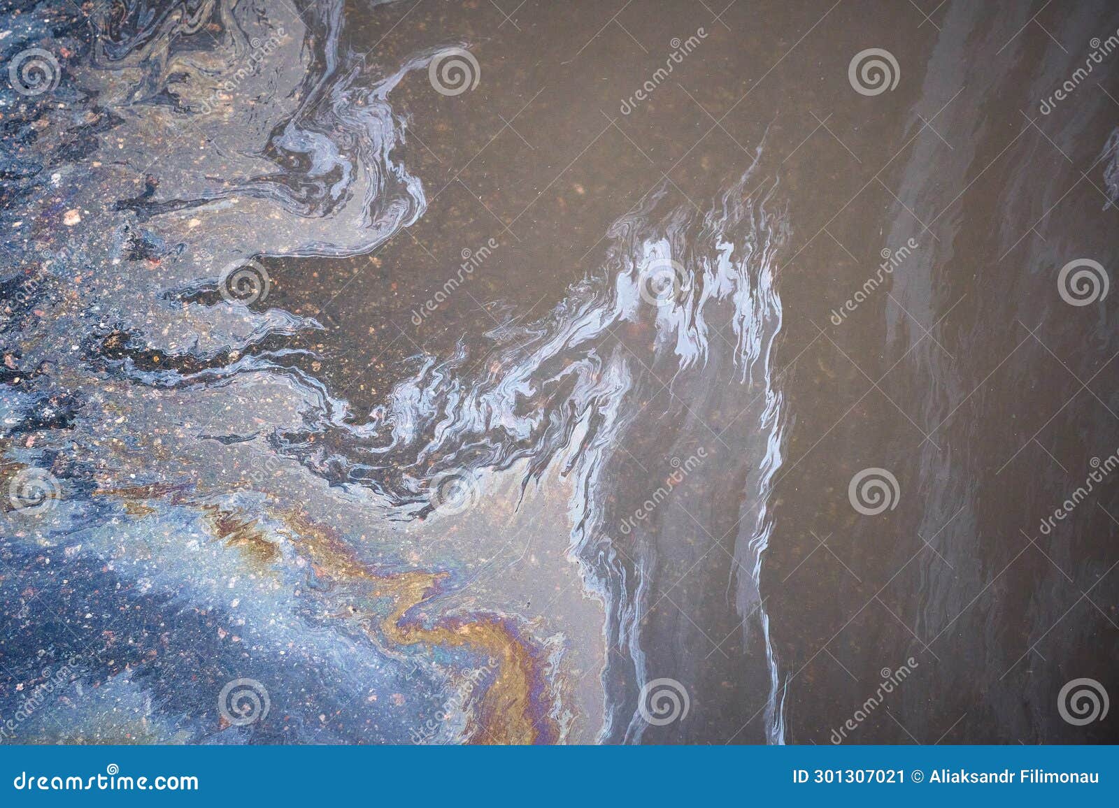 A Marble Texture of a Rainbow Spill of Gasoline on a Sidewalk in a ...