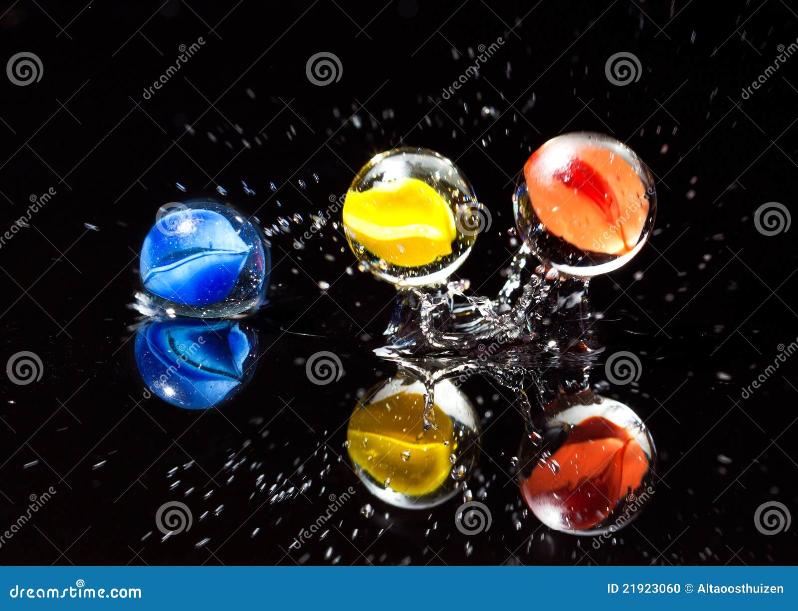 Marbles in water splash stock photo. Image of colorful - 21923060