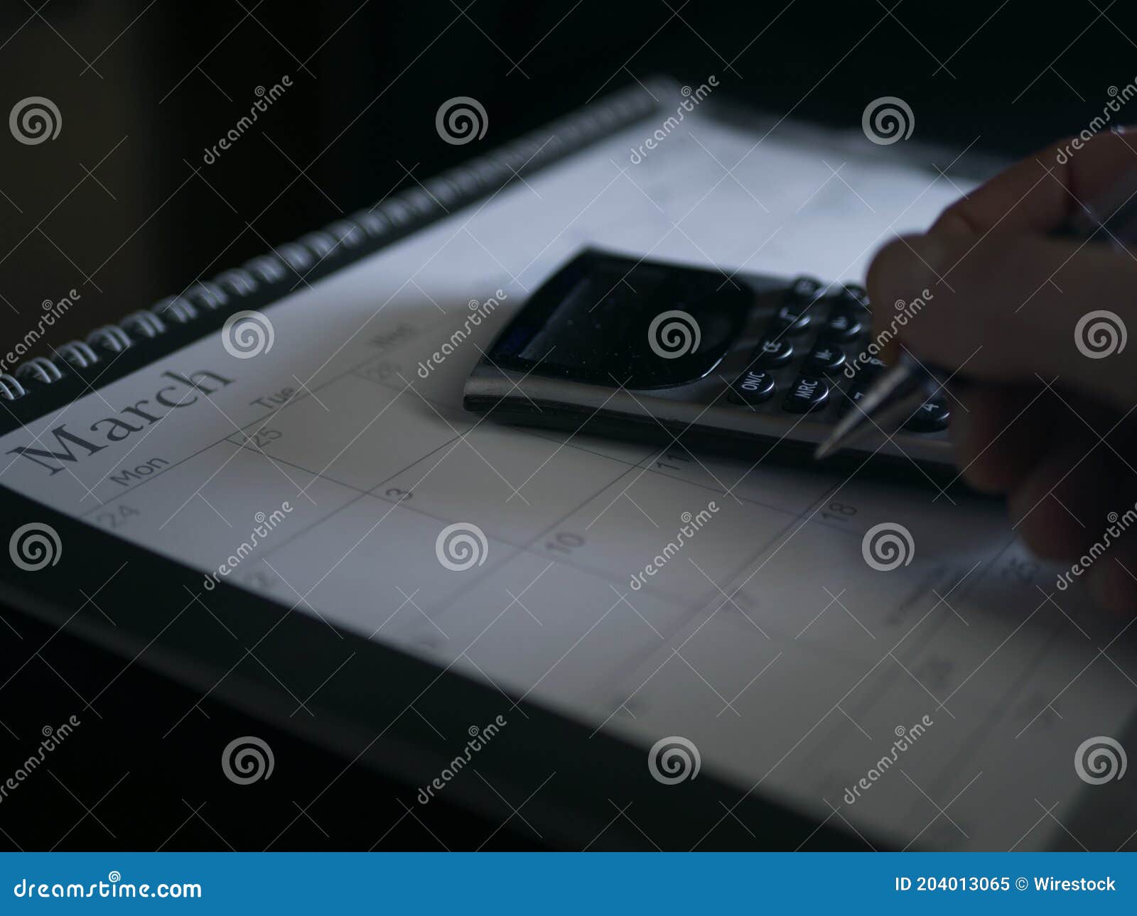 March Calendar with Hands Adding on Calculator Stock Image - Image of ...
