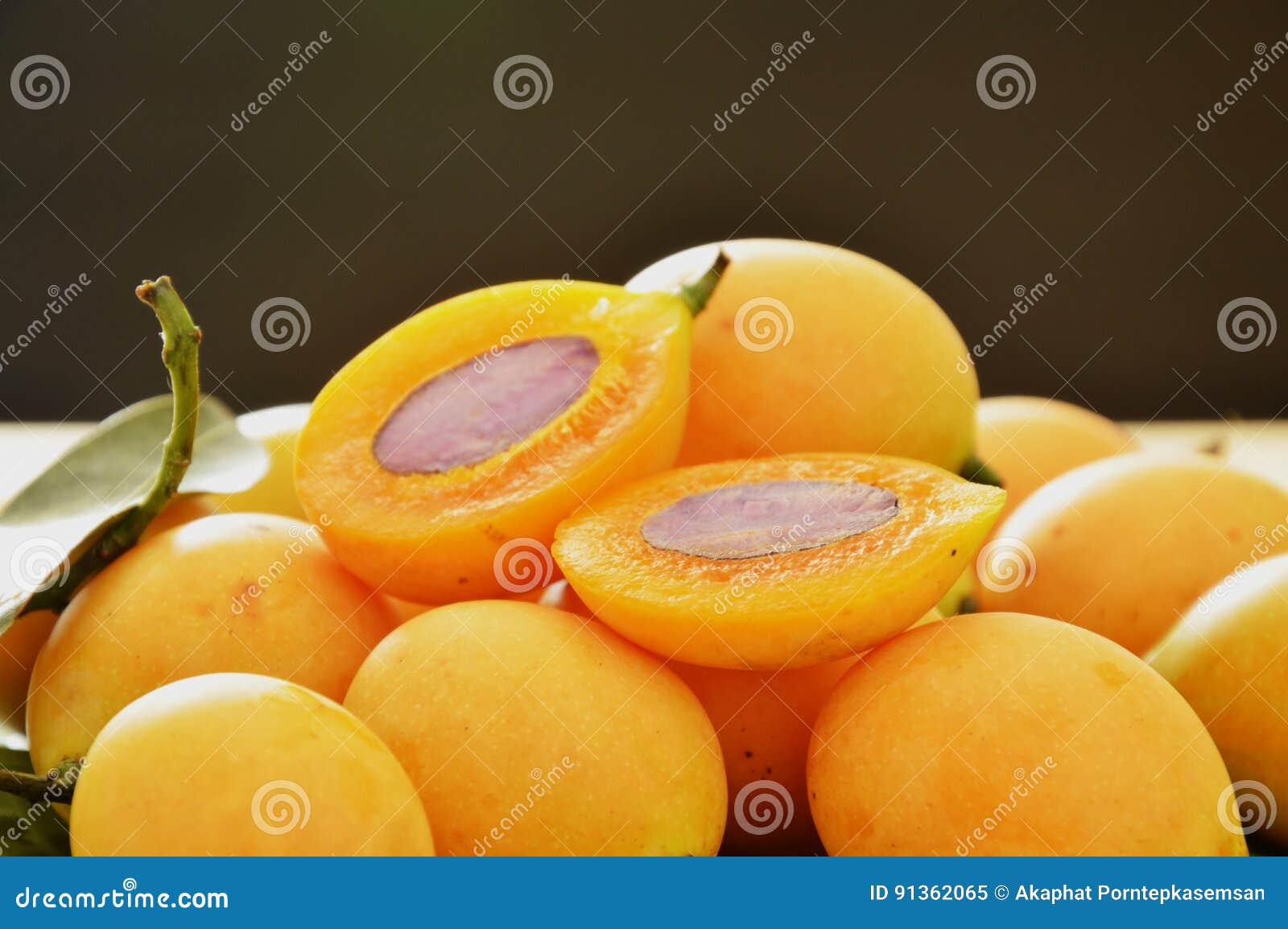 Marian Plum Tropical Fruit Produced in Summer Half Cut on Black ...