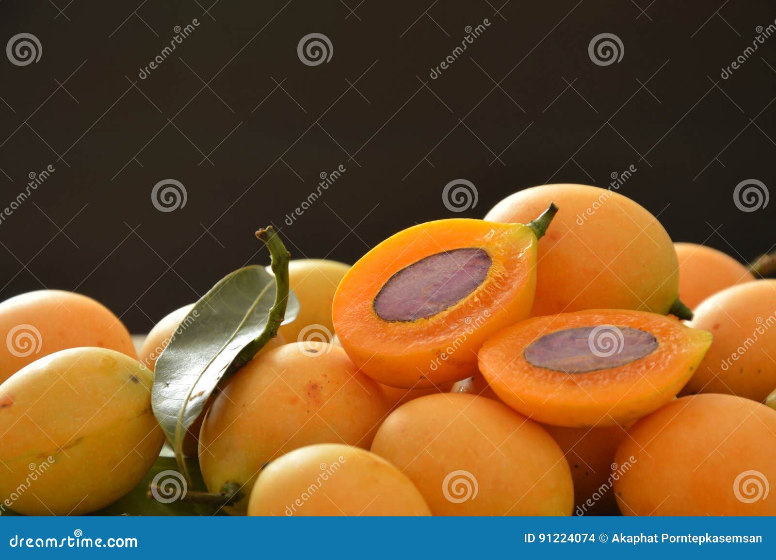 Marian Plum Tropical Fruit Produced in Summer Half Cut on Black ...