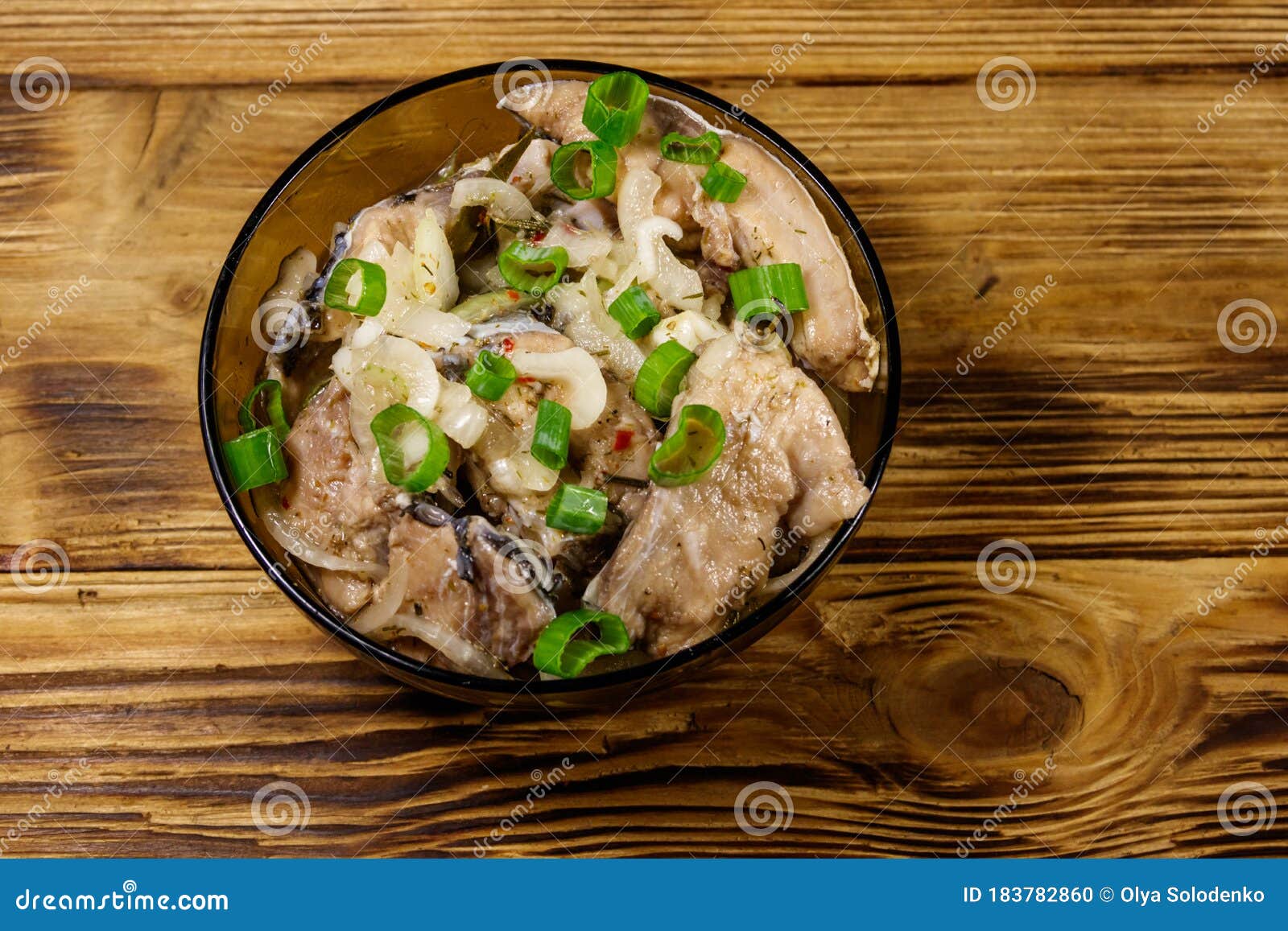 Marinated Carp in Glass Bowl on Wooden Table. Top View Stock Photo ...
