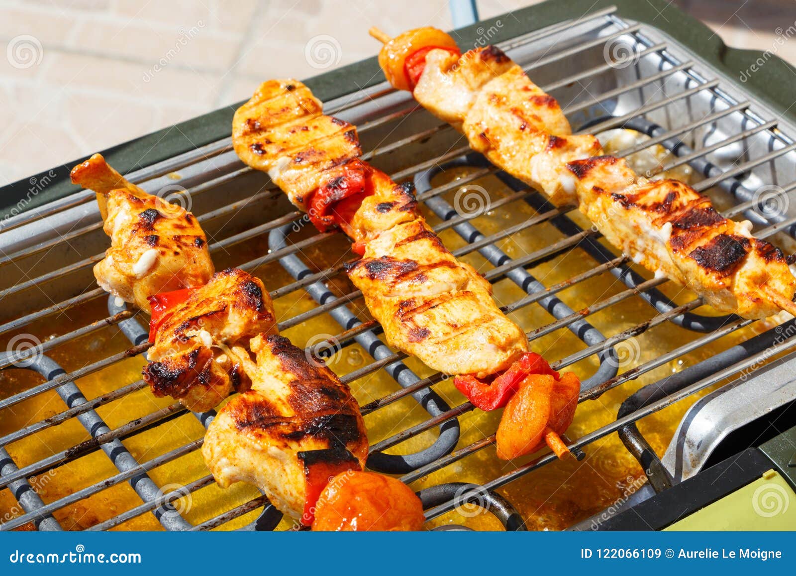 Marinated Chicken Brochette on Electric Barbecue Stock Image - Image of ...