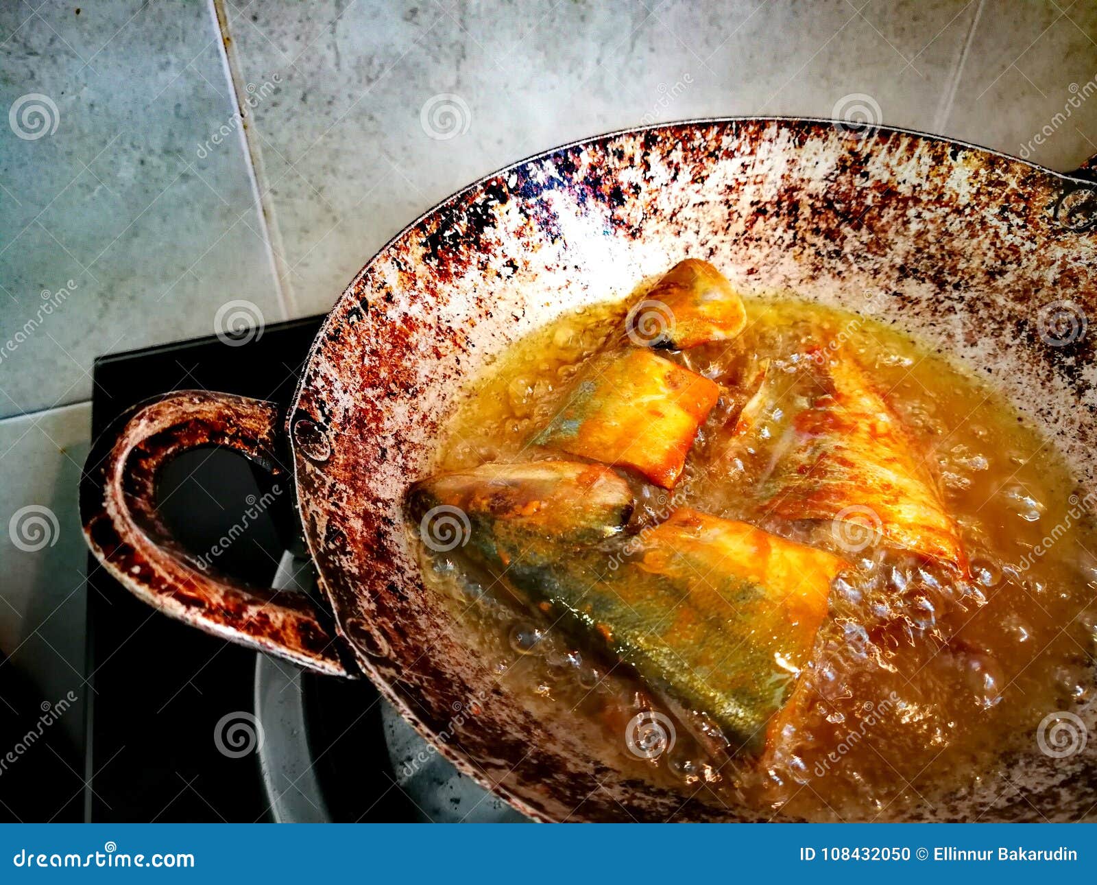 Marinated Fish with Seasoning is Fried in a Pan. Stock Photo - Image of ...