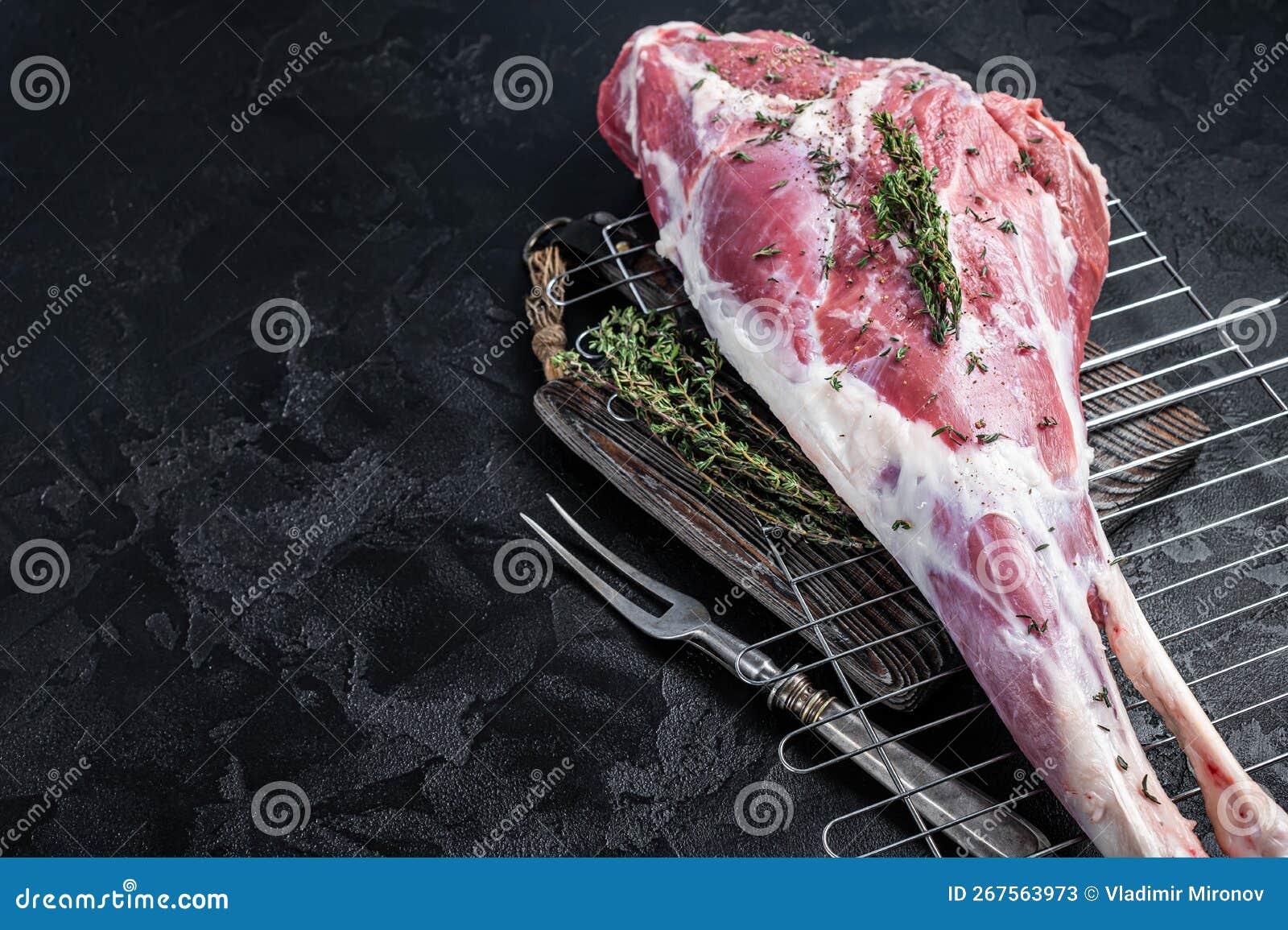 Marinated Raw Lamb Mutton Leg Thigh with Thyme and Spices. Black ...