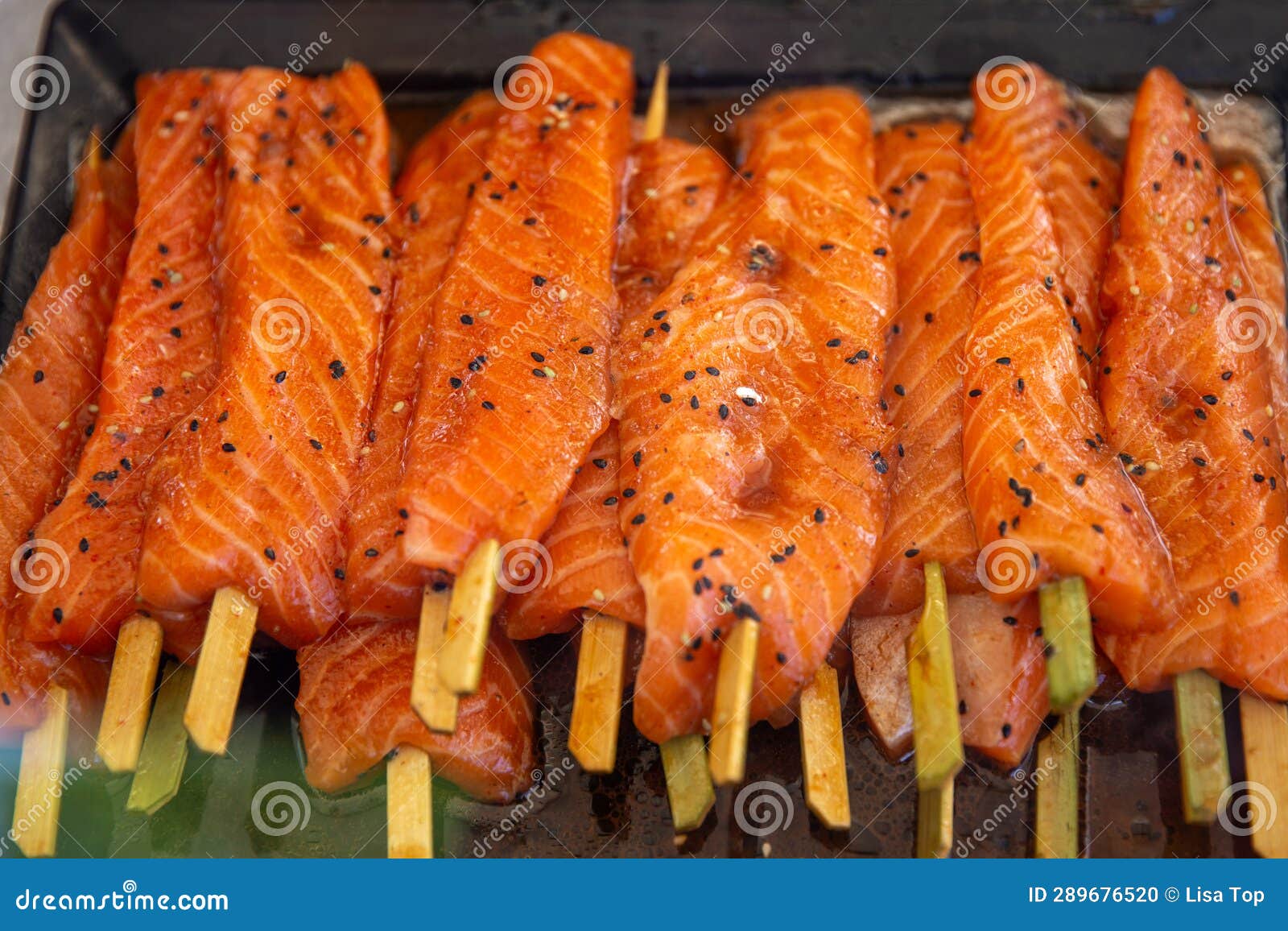 Marinated Salmon on a Stick Stock Photo - Image of vendor, fish: 289676520