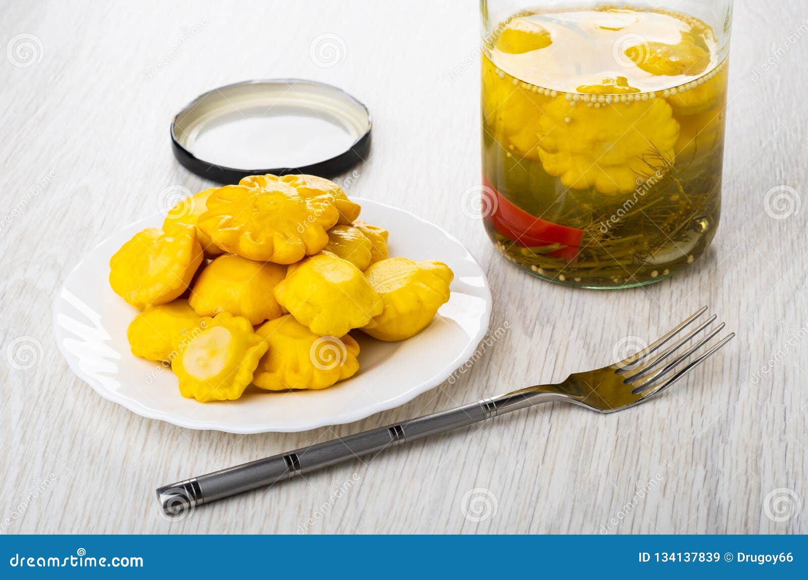 Marinated Squash in Plate, Jar with Squash, Fork on Table Stock Image ...