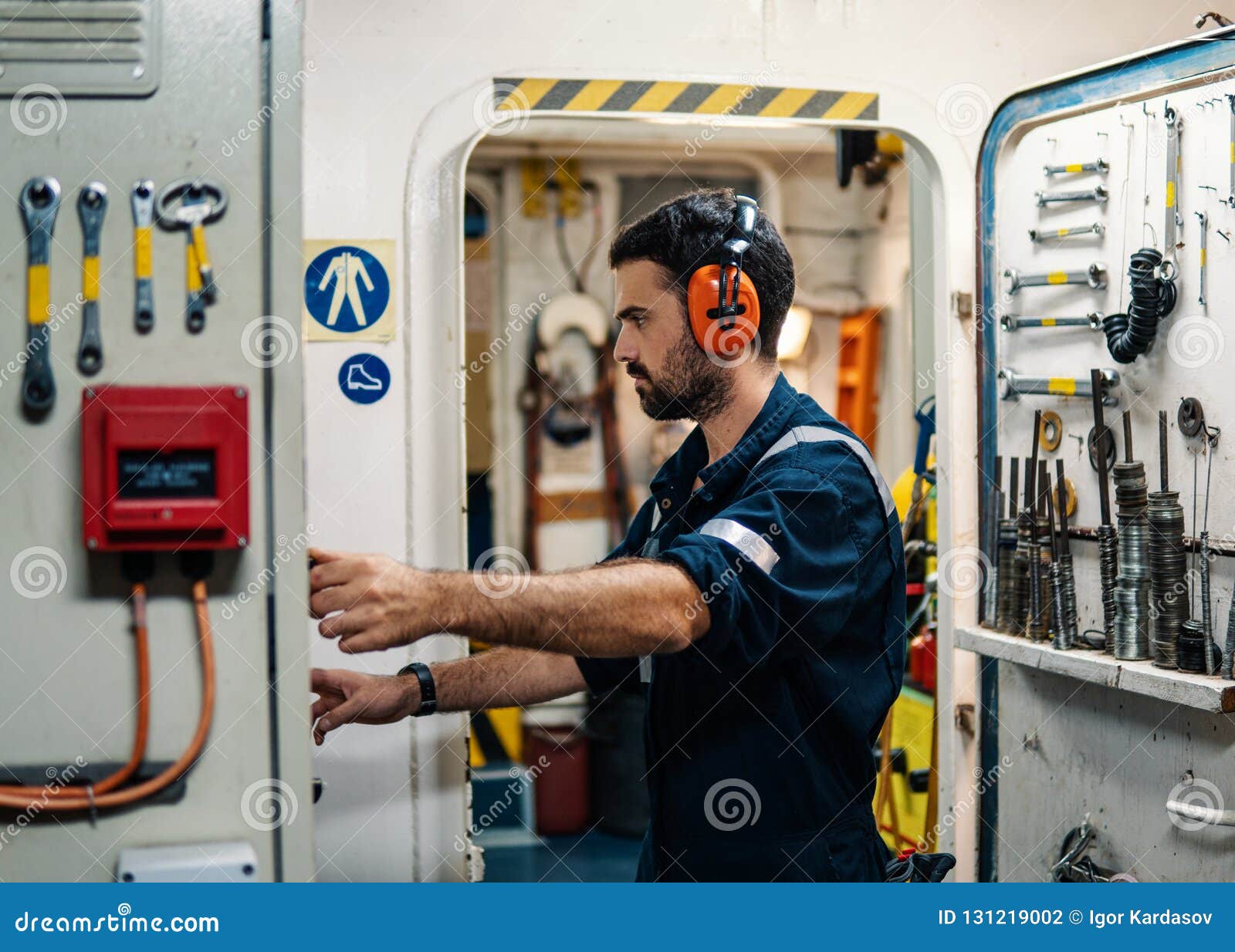 Marine Engineer Officer Working in Engine Room Stock Photo - Image of ...