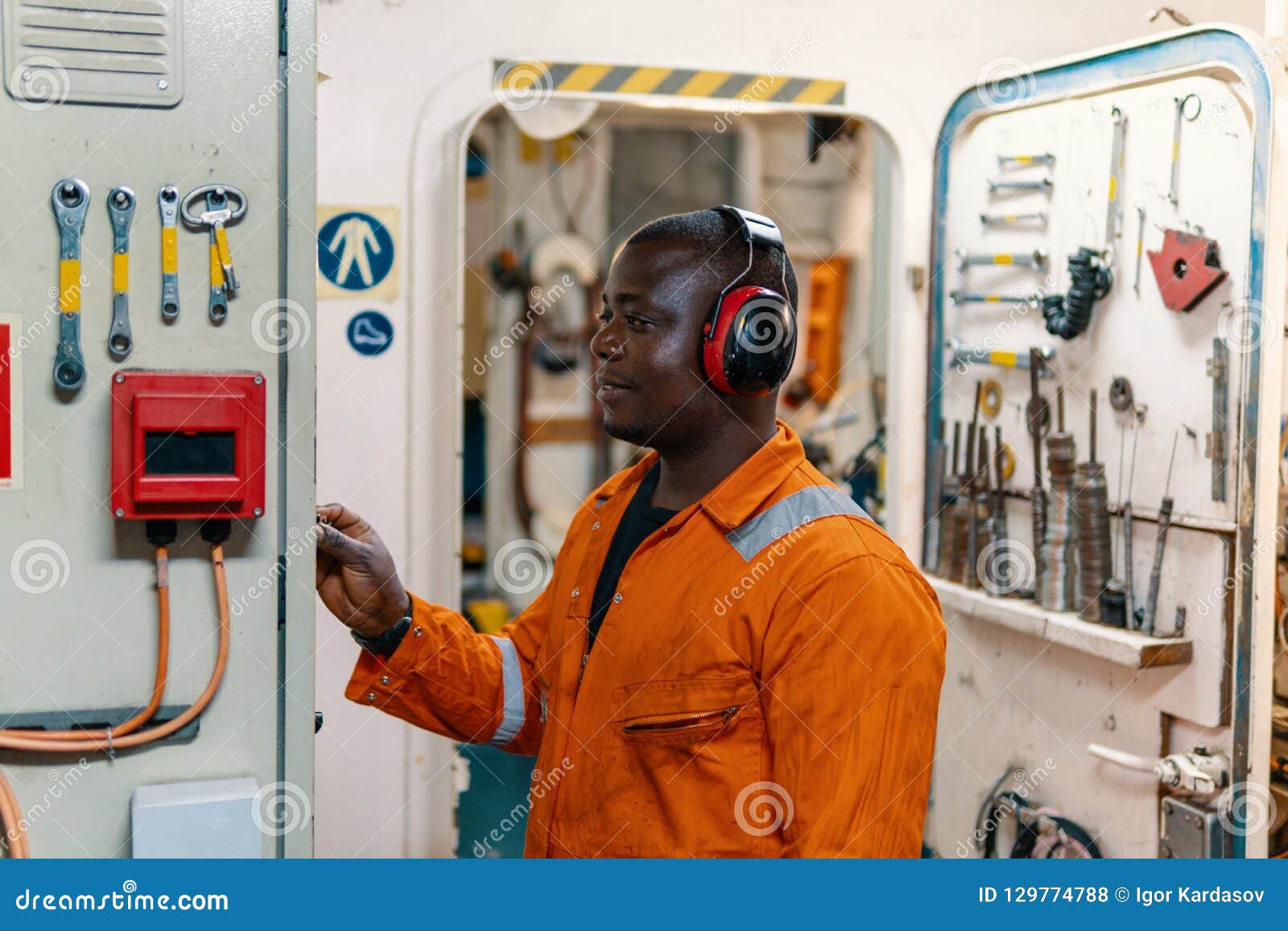 Marine Engineer Officer Working in Engine Room Stock Photo - Image of ...