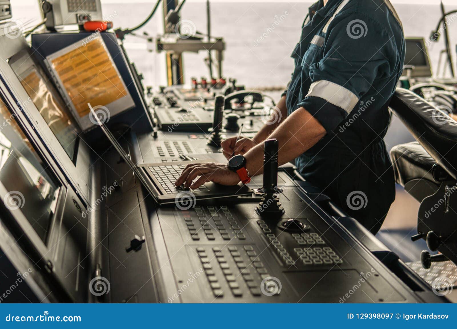 Marine Navigational Officer is Using Laptop or Notebook at Sea Stock ...
