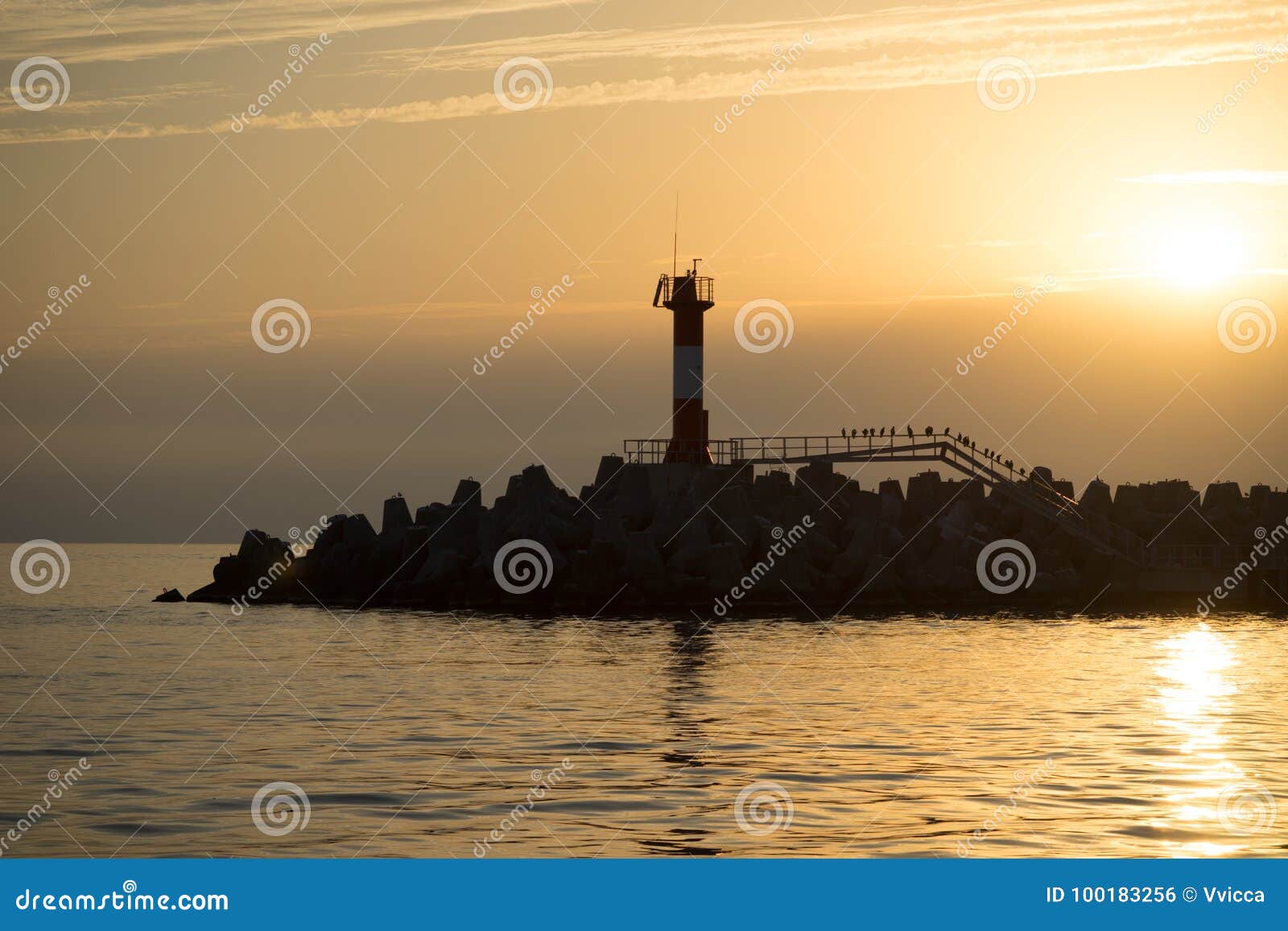 Marine Sunset with a View of the Navigation Light Stock Photo - Image ...