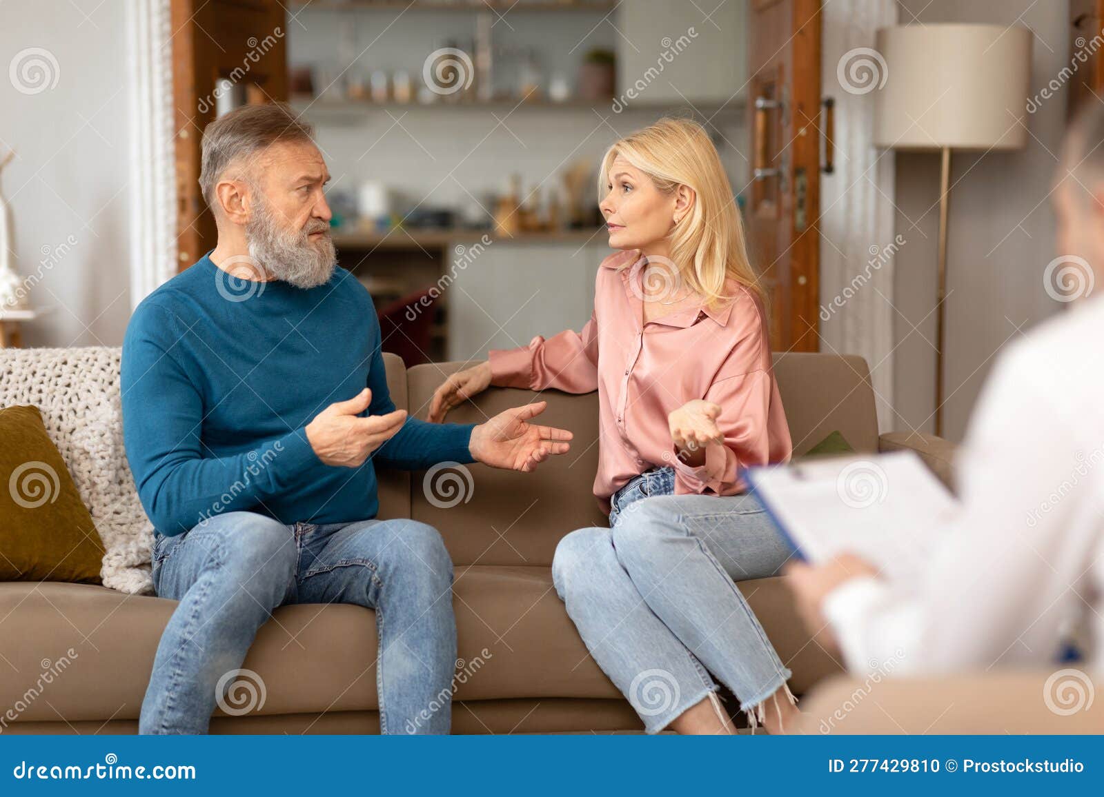 Unhappy Mature Couple Having Quarrel During Marital Therapy Session