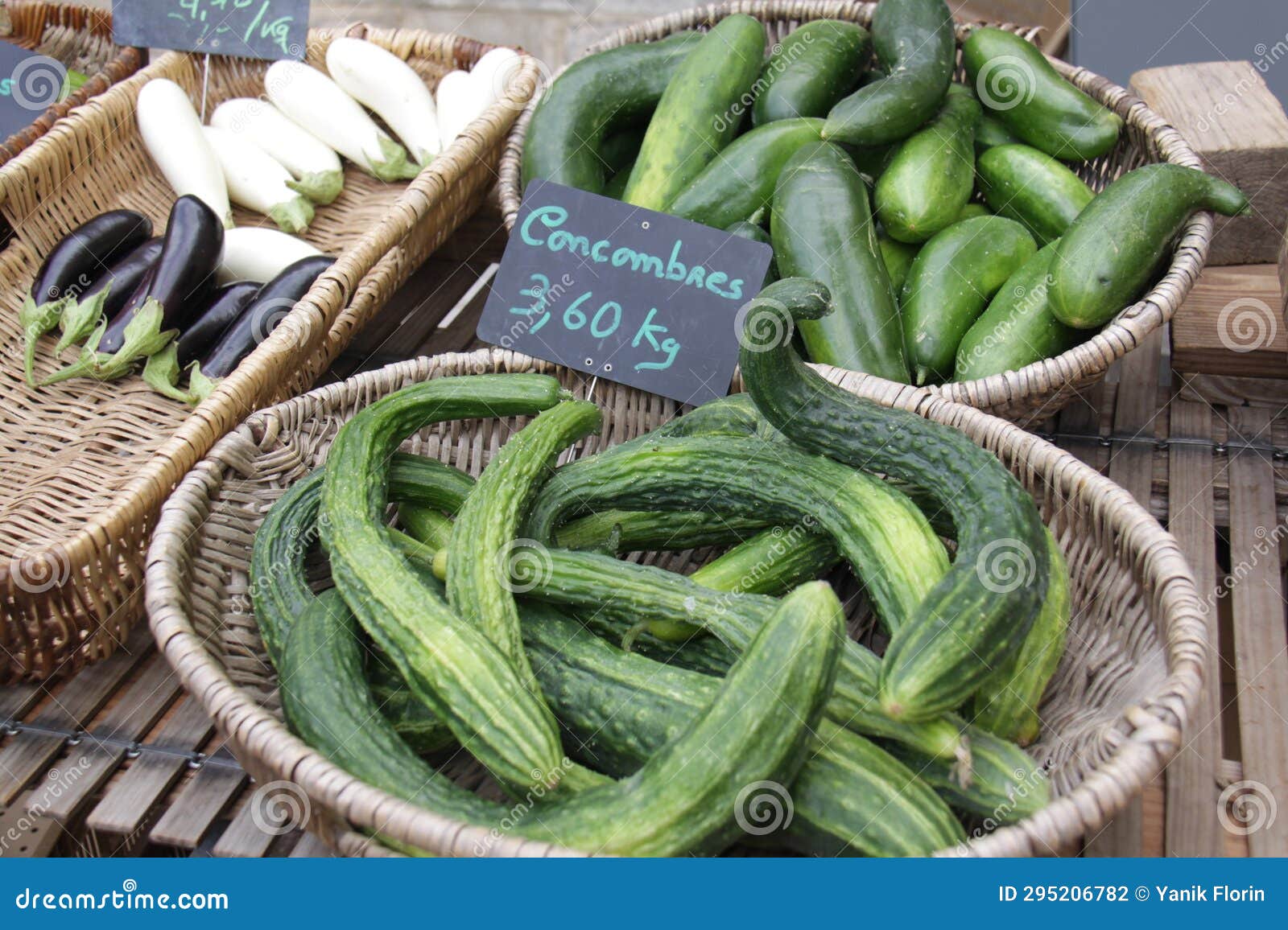 Market Stall Display of Oddly Shaped Cucumbers (text on Sign Read ...