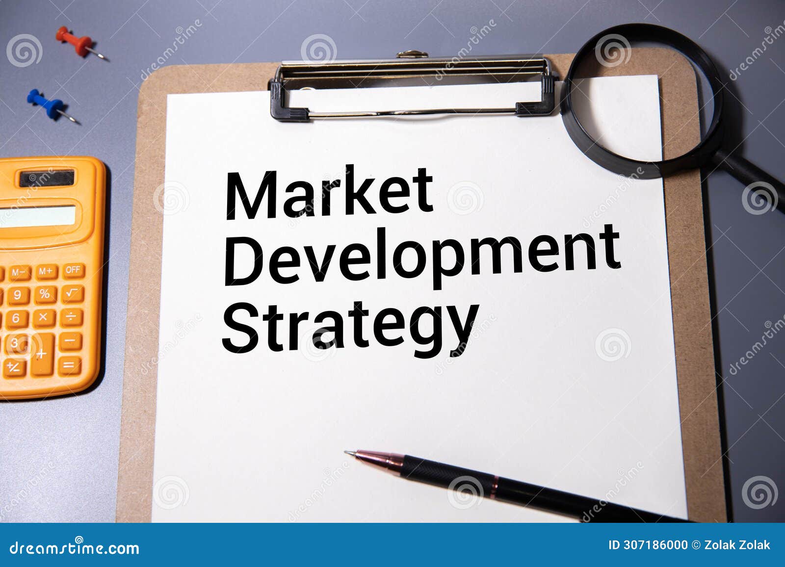 Marketing Strategy Text on a Notebook with Calculator on Diagram ...