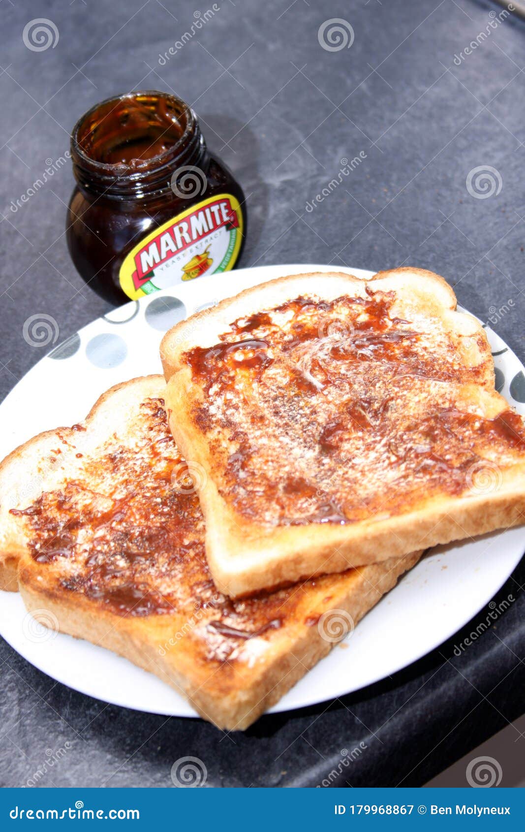 Marmite on Two Pieces of Toast with the Jar by the Side Editorial ...