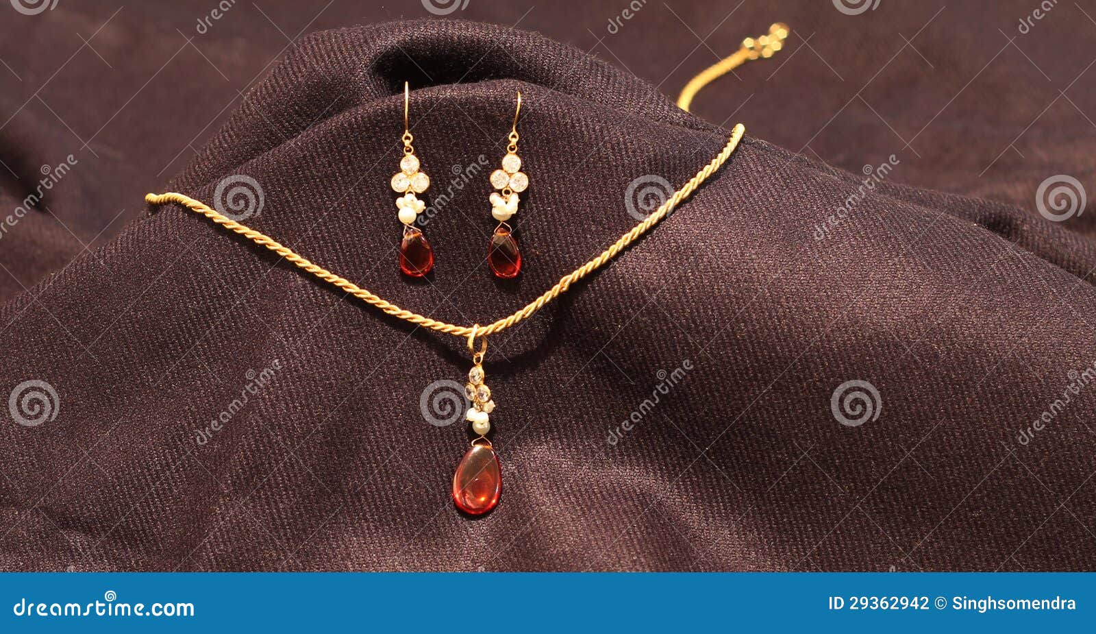 Maroon Jewelry Set in Black Background Stock Photo - Image of metallic ...