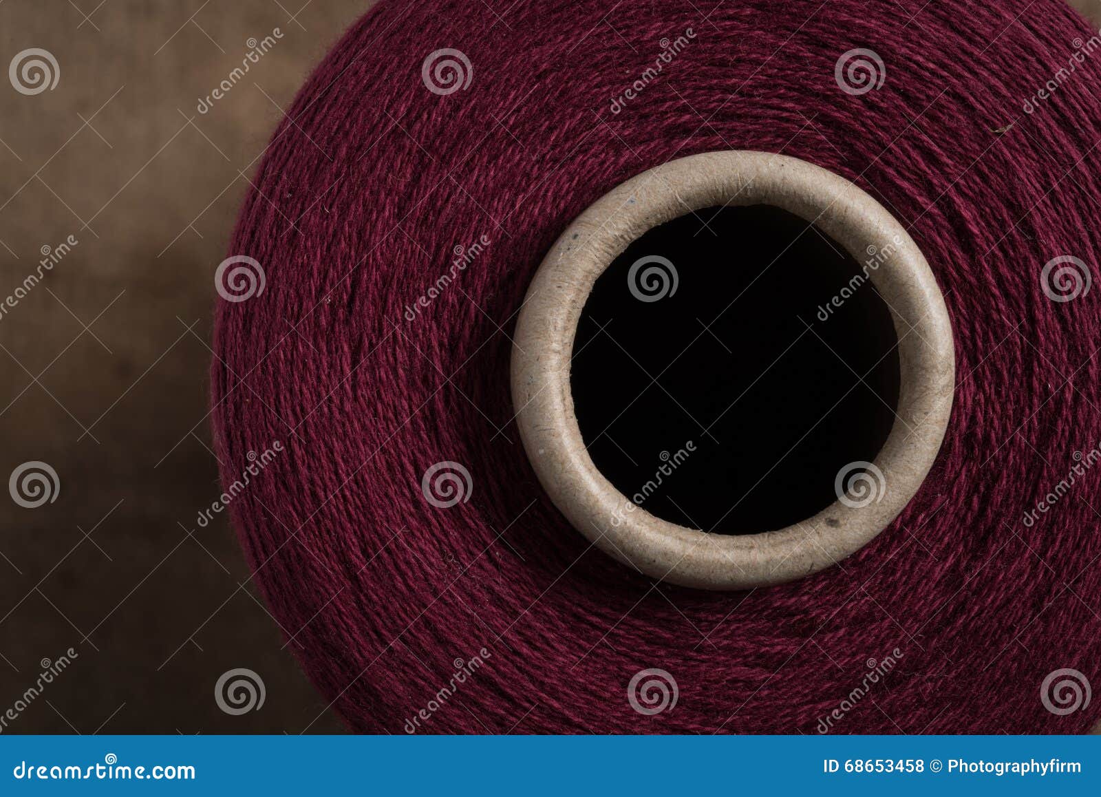 Maroon Thread Spool Hole stock photo. Image of yarn, wool - 68653458