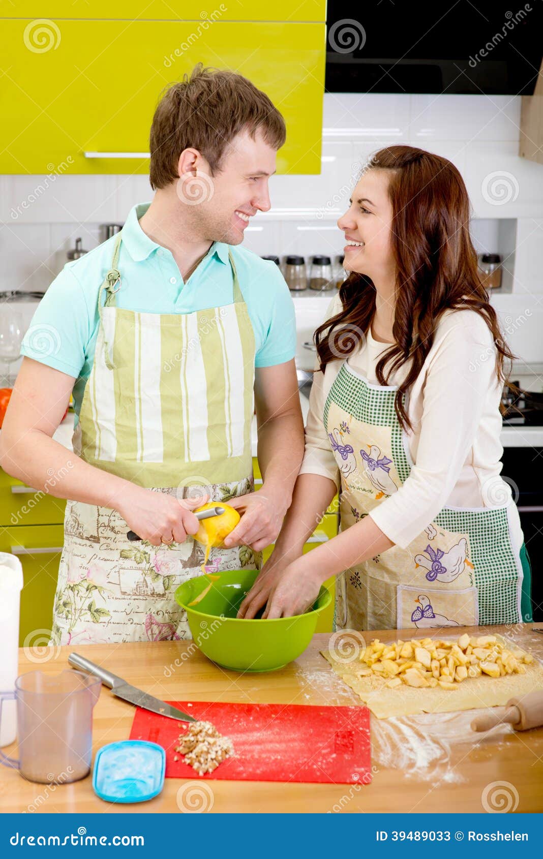 Married Couple Cooking Apple Pie at the Kitchen at Home Stock Image ...