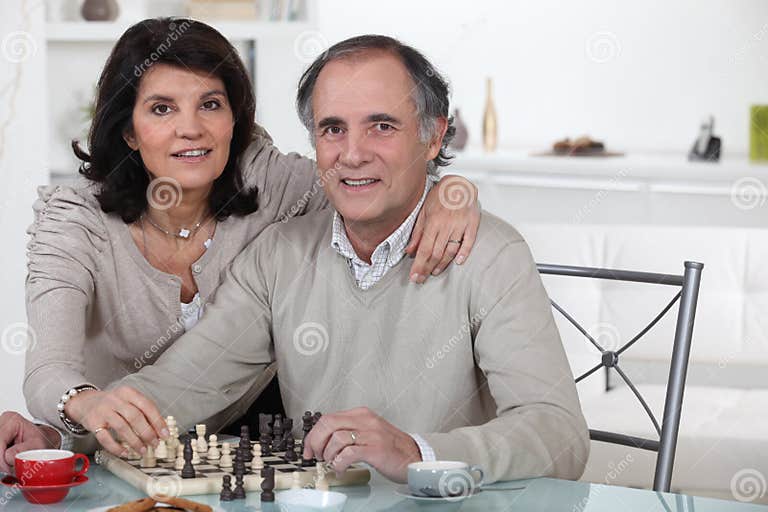 Married Couple Playing Chess Stock Photo - Image of pleasure, maturity ...